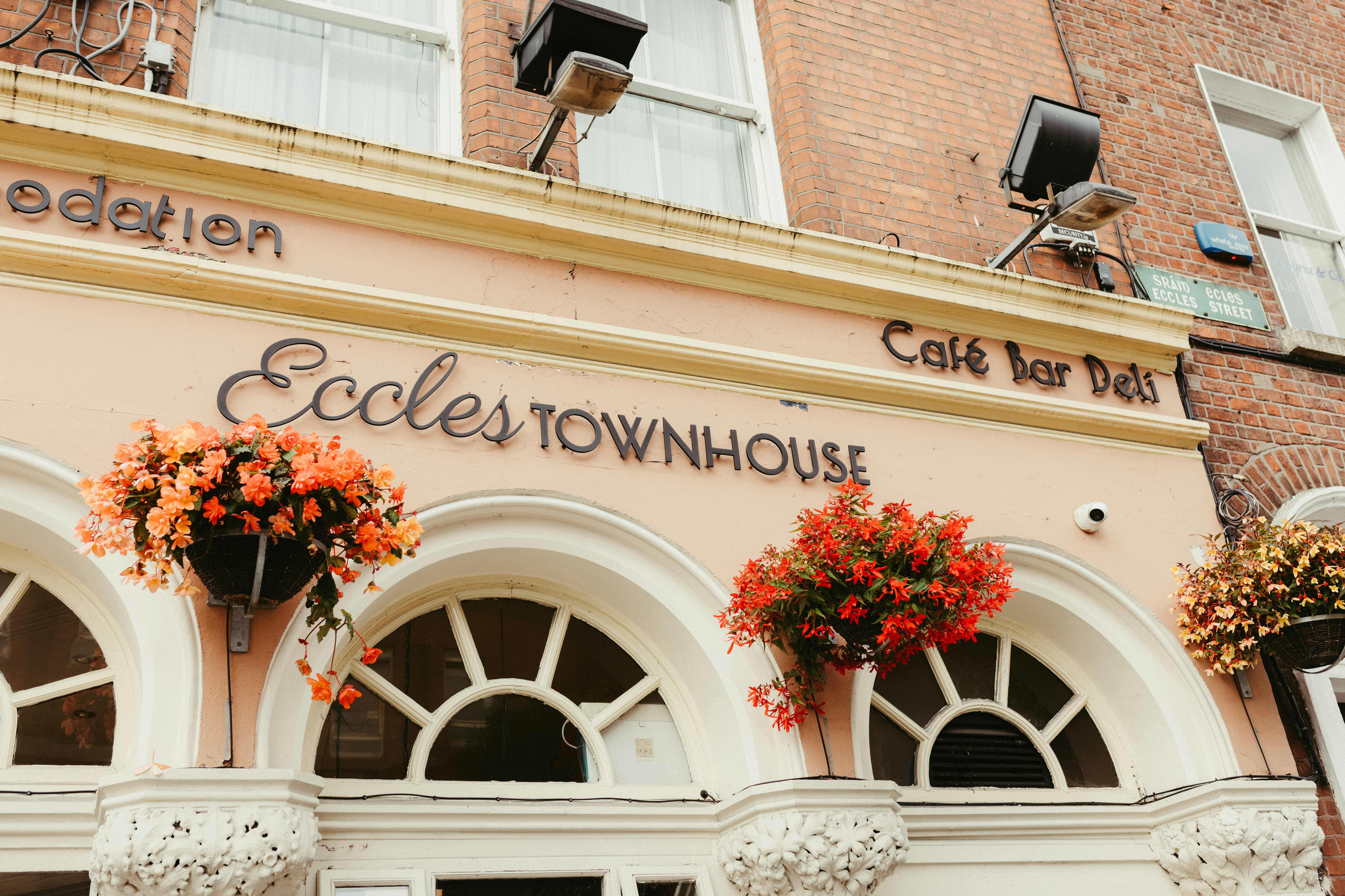 Eccles Townhouse: Floral Arches Framing a Classic Facade