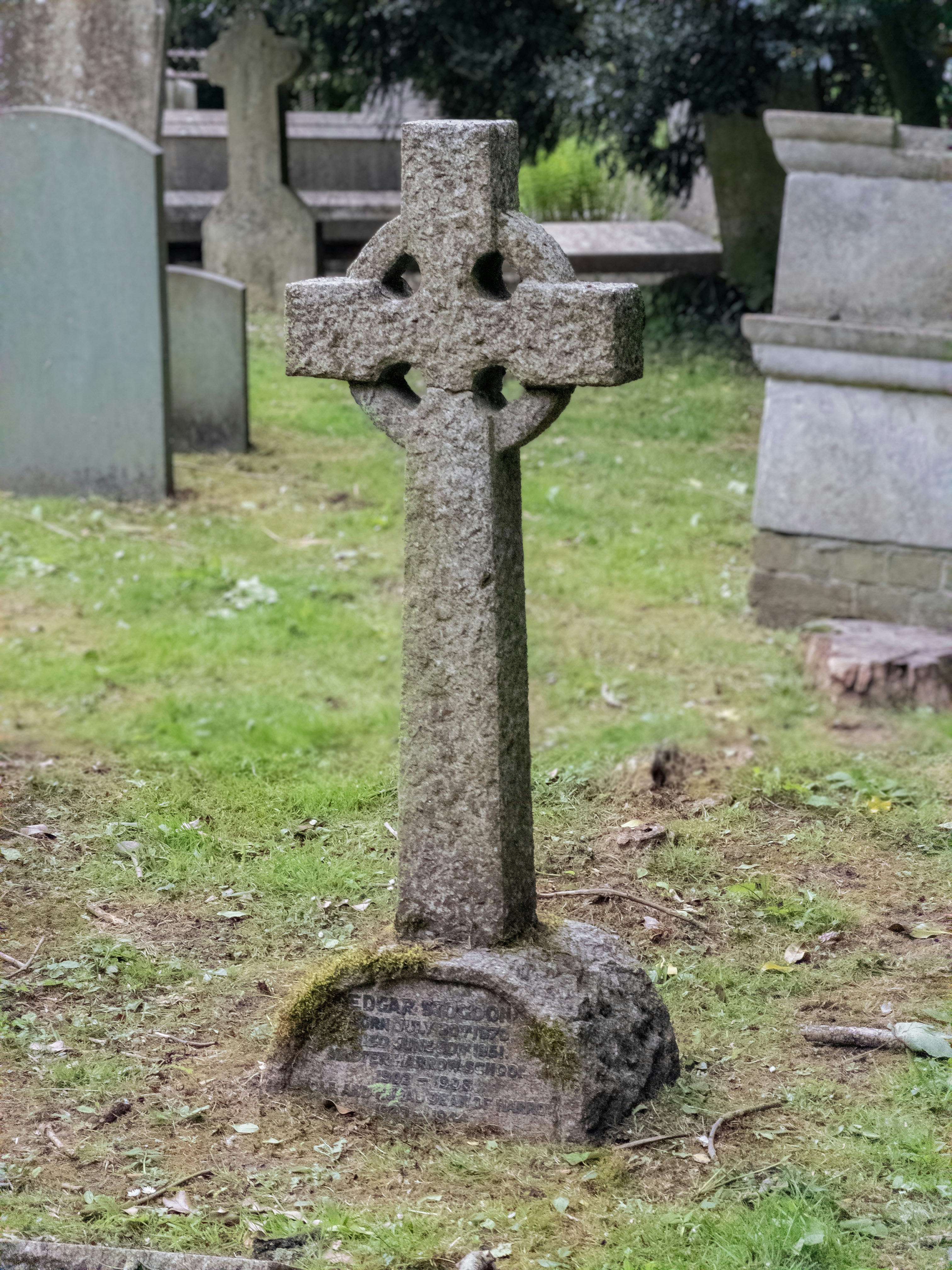 Weathered Celtic Cross Marker in a Quiet Cemetery