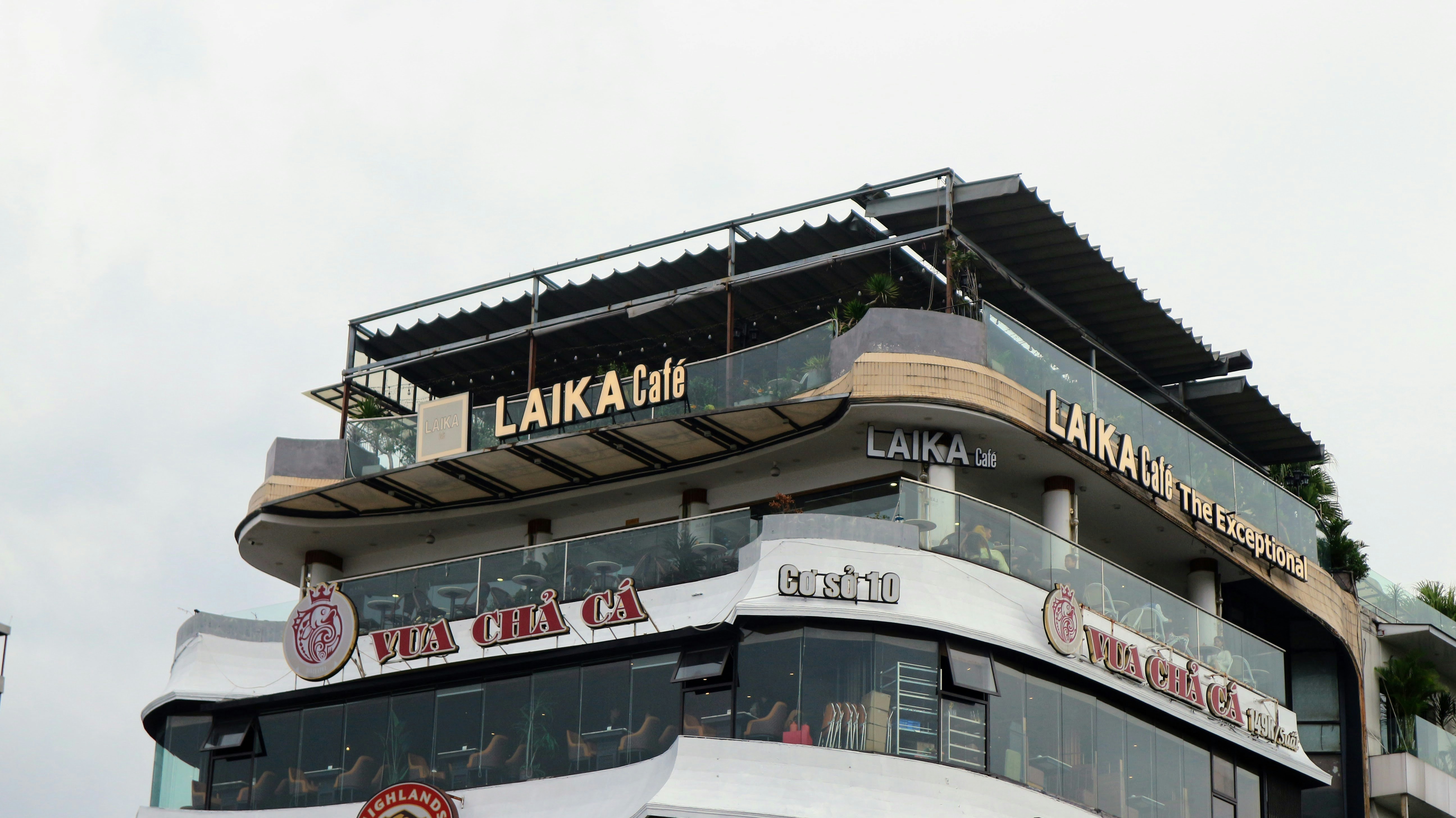 Vertical Vessel: A Café-Top Bus Tower Reaching for the Sky