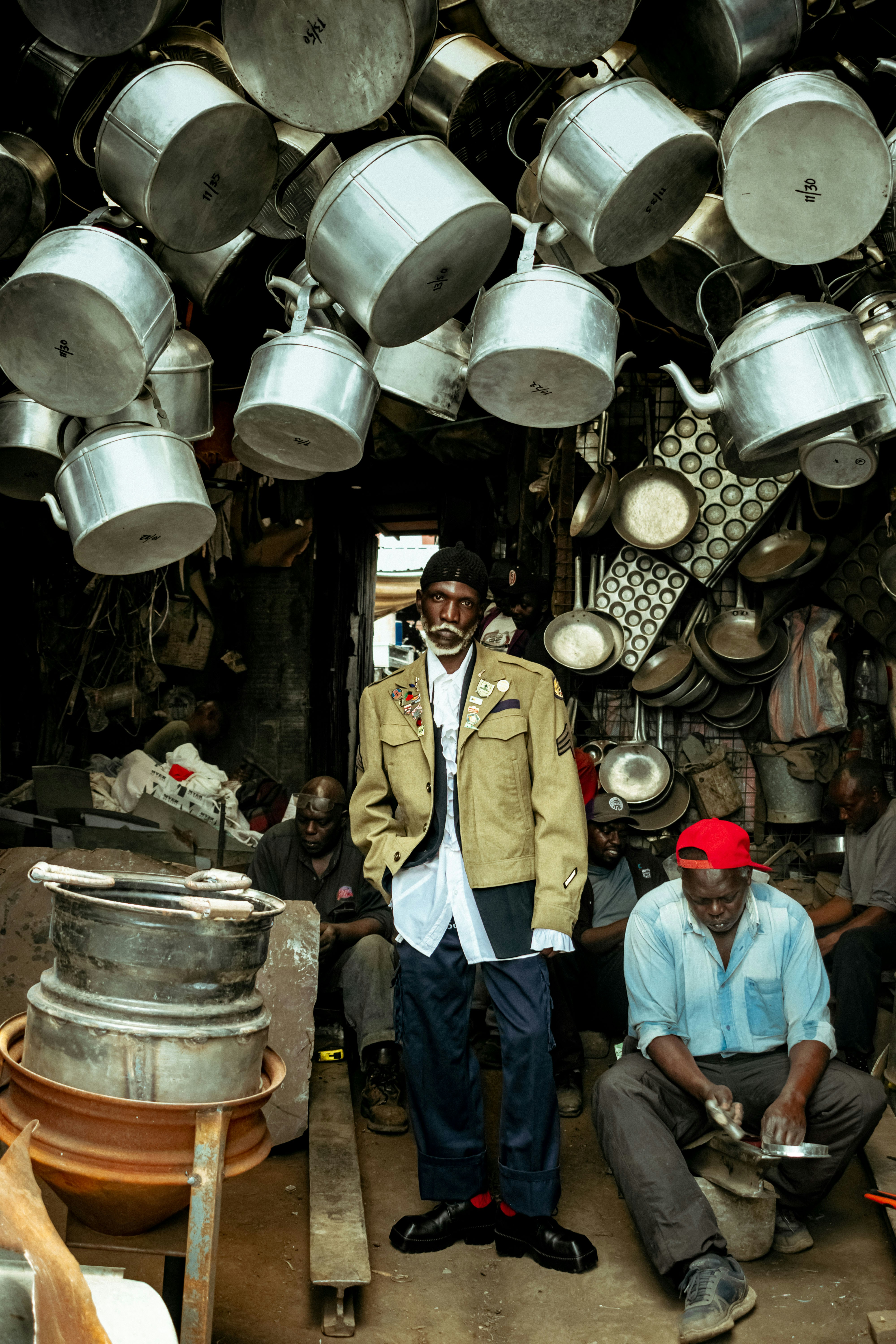 The Collector of Quiet Metal: A Portrait in a Pot-Piled Alley