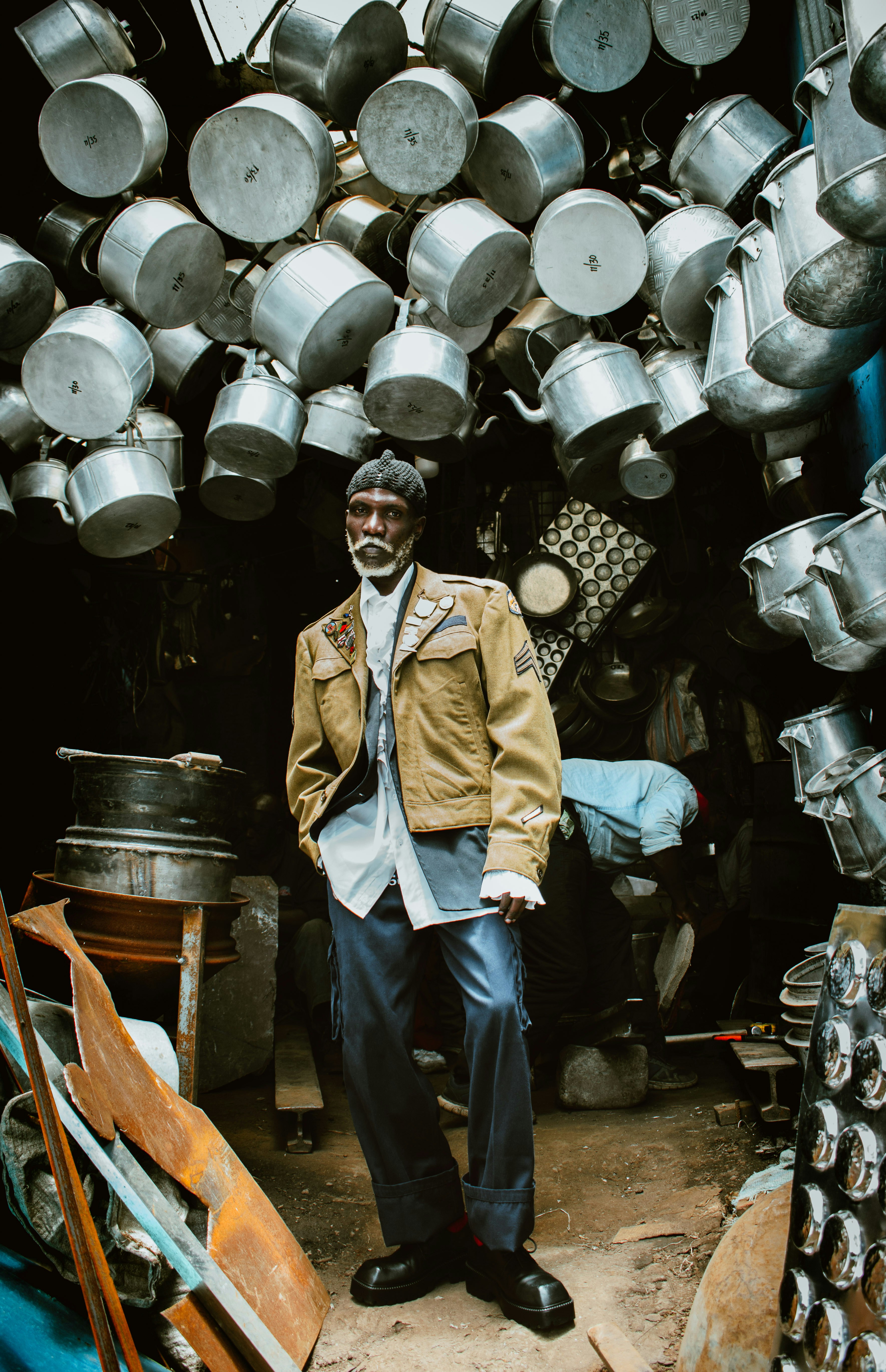 Portrait in a Metallic Cavern: A Factory Worker Stepping Forward