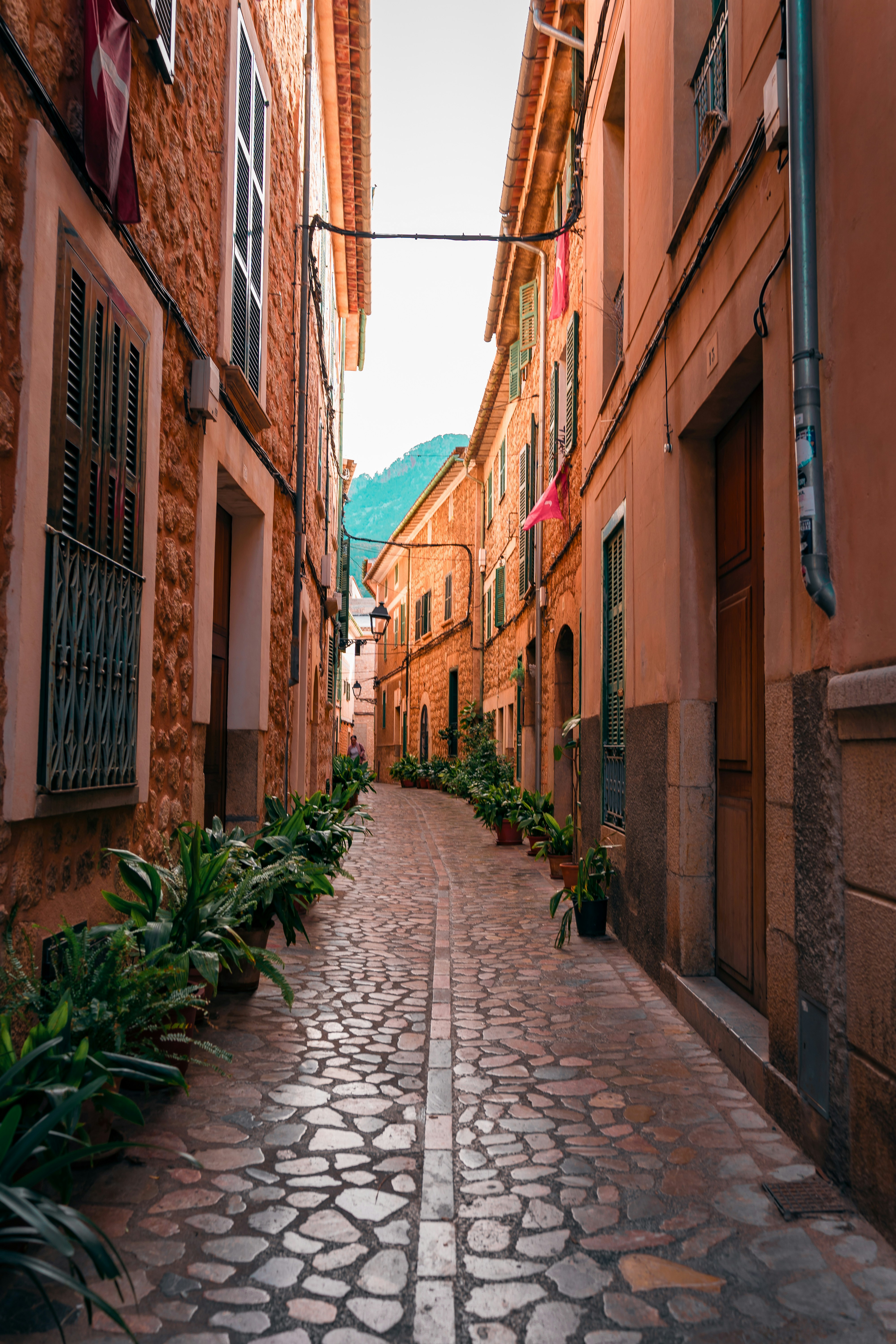 Narrow Mediterranean Lane Framed by Sunlit Facades