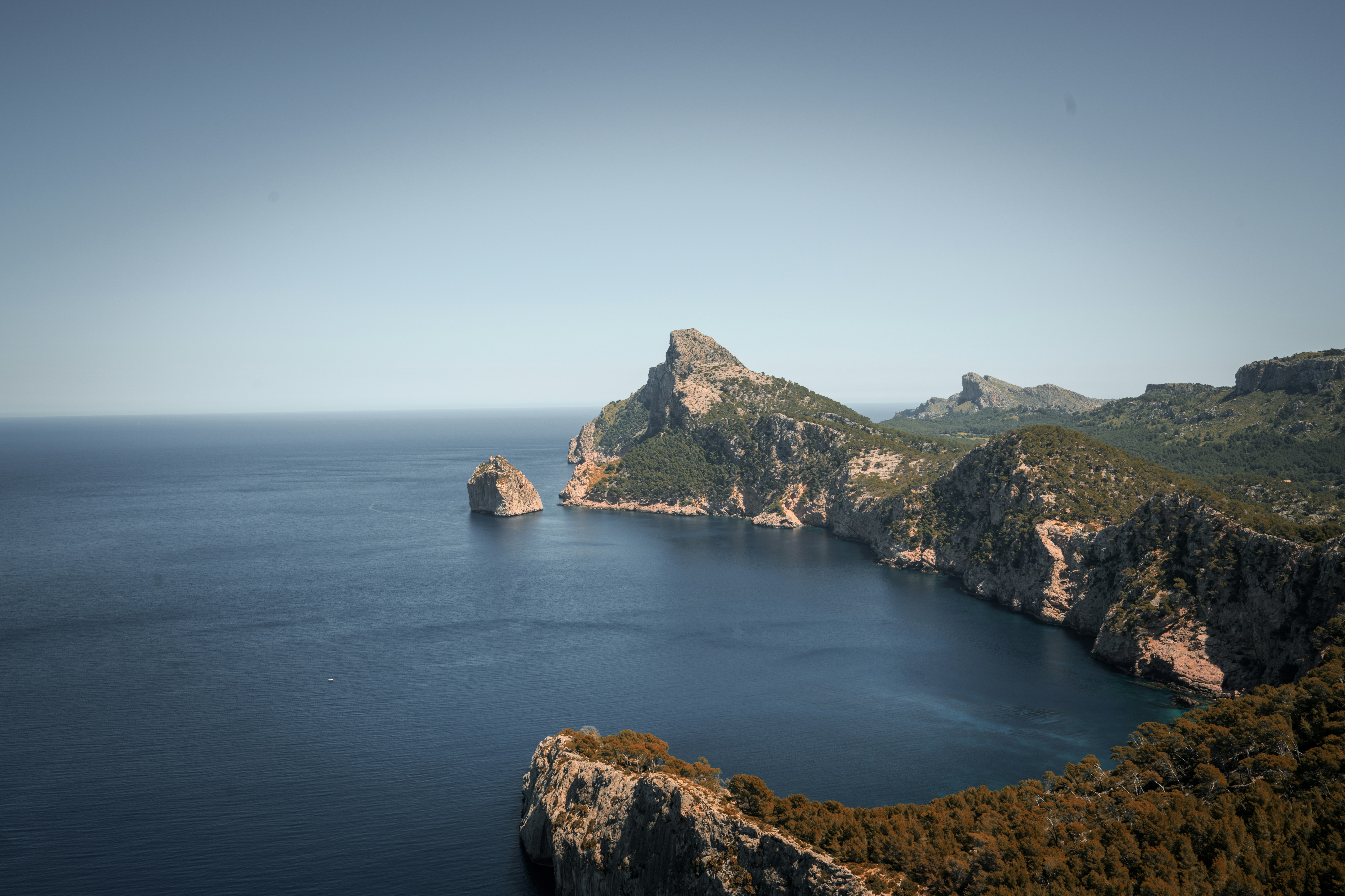 Crested Coastline: A Quiet Panorama of Sea and Cliff Sepia