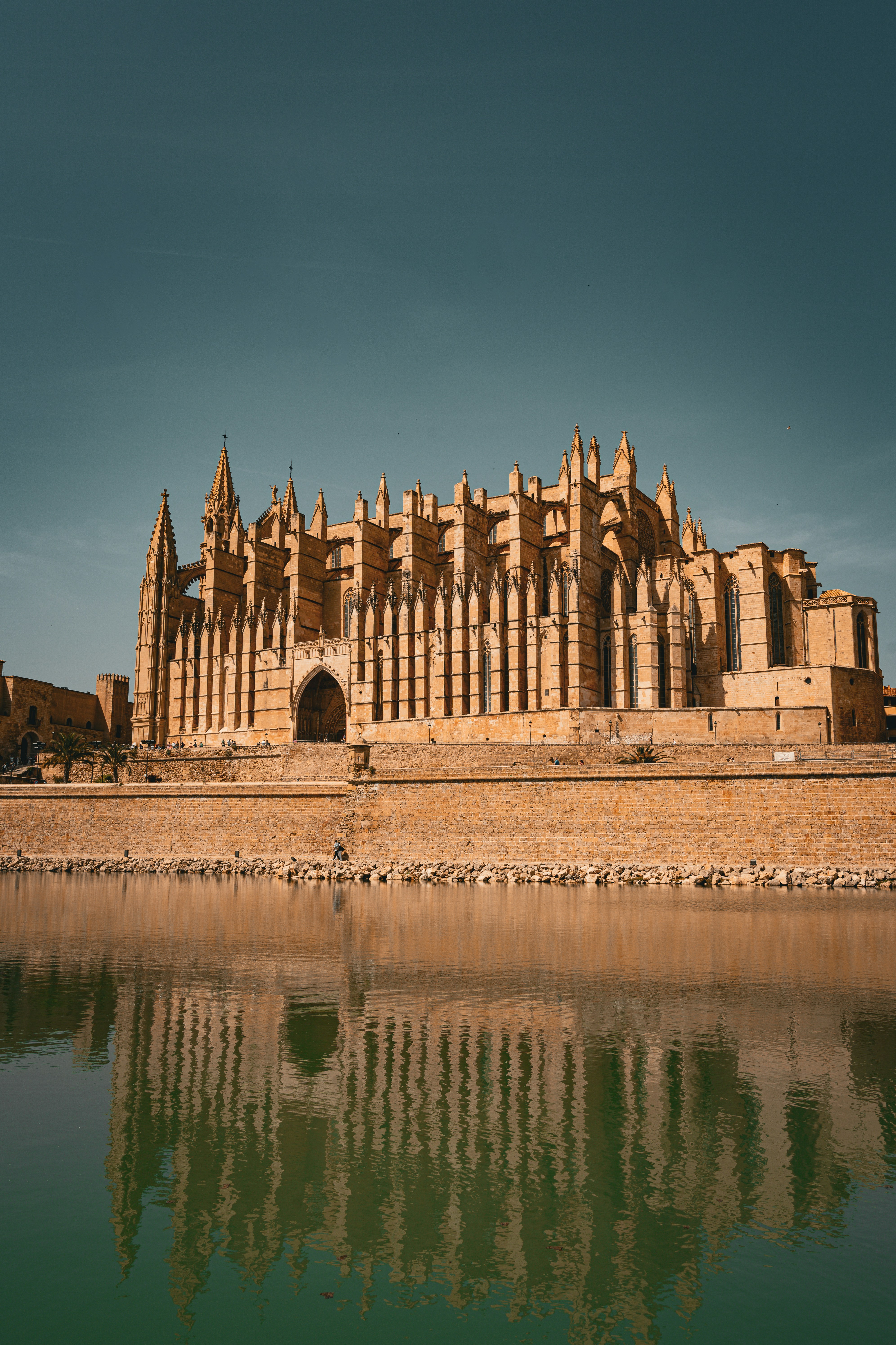 Stone Cathedral by the River: Gothic Facades Reaching Toward a Quiet Sky