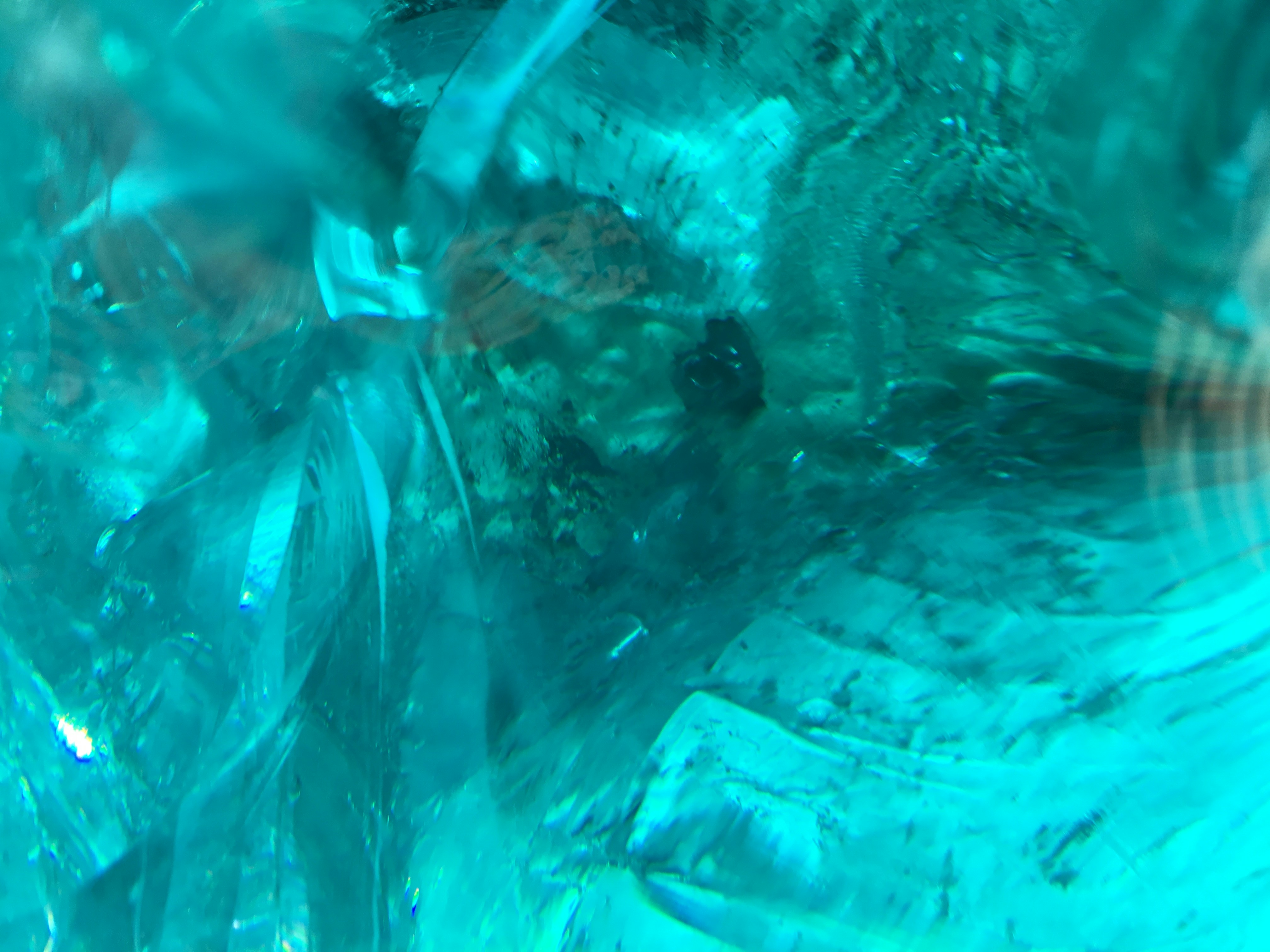 Turquoise Facets: Refractions in a Shimmering Prism