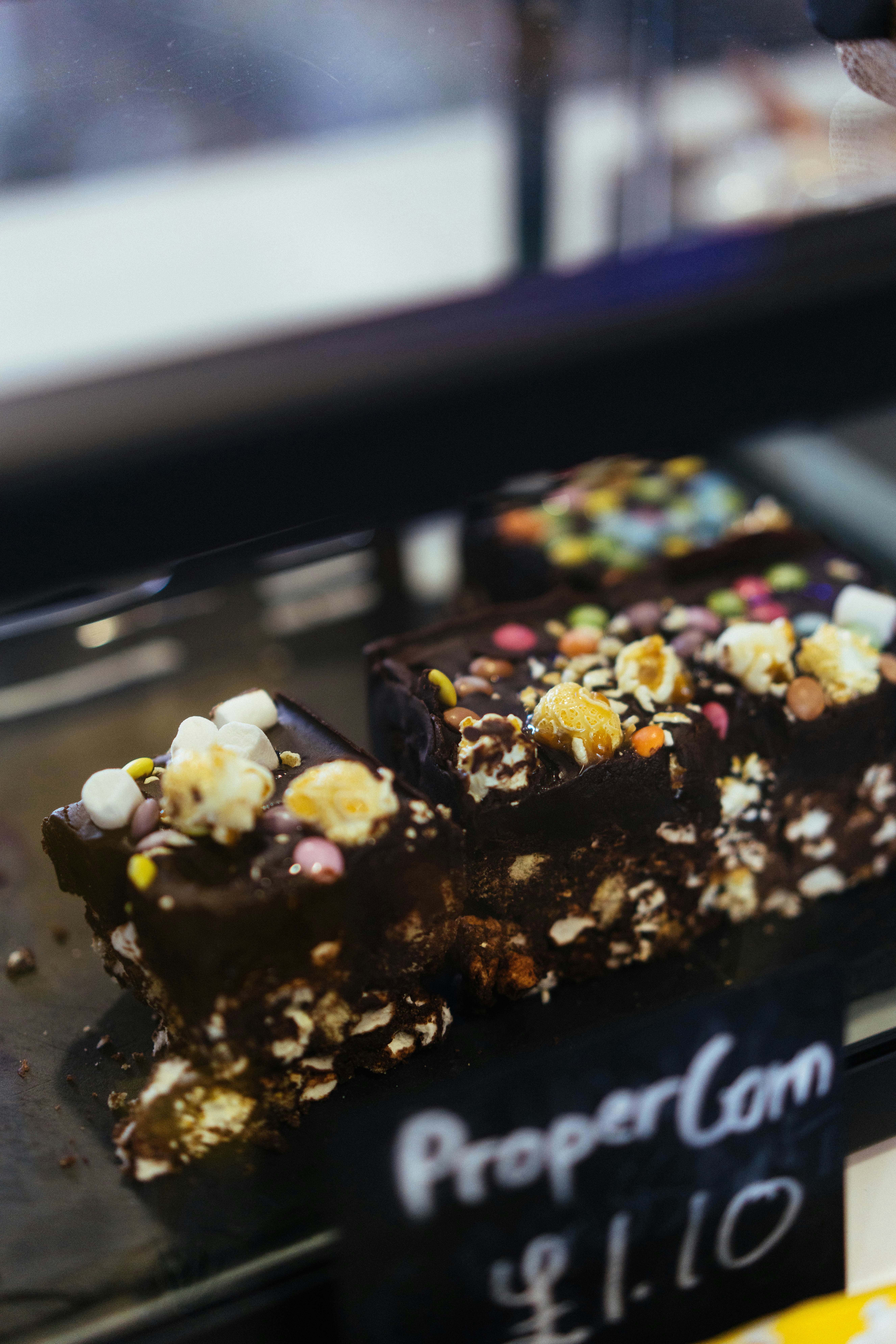 Chocolaty Block of Crunch with Colorful Crumbles Under Showcase Light
