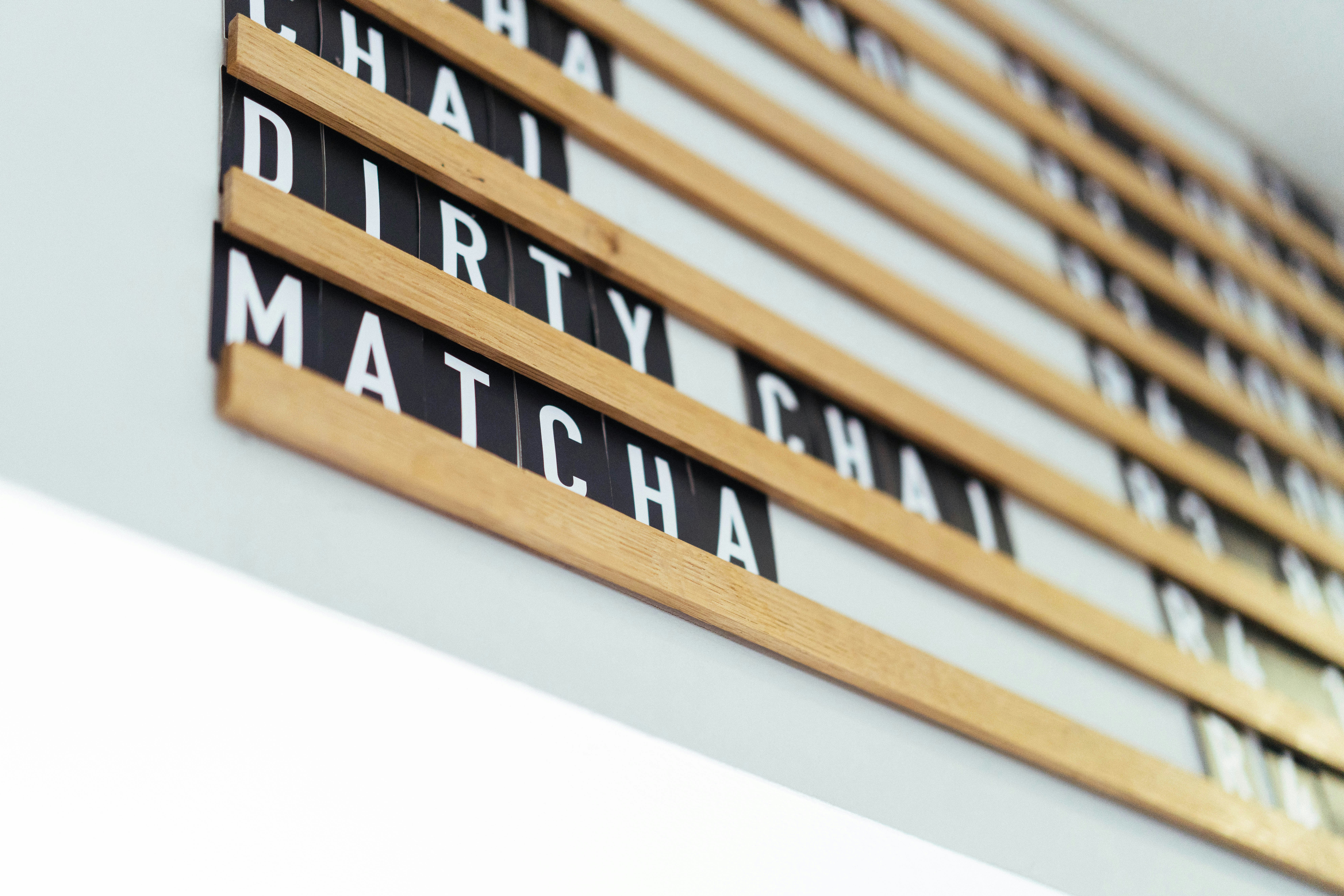 Letters in Wooden Slats: A Minimalist Board Sign in Motion
