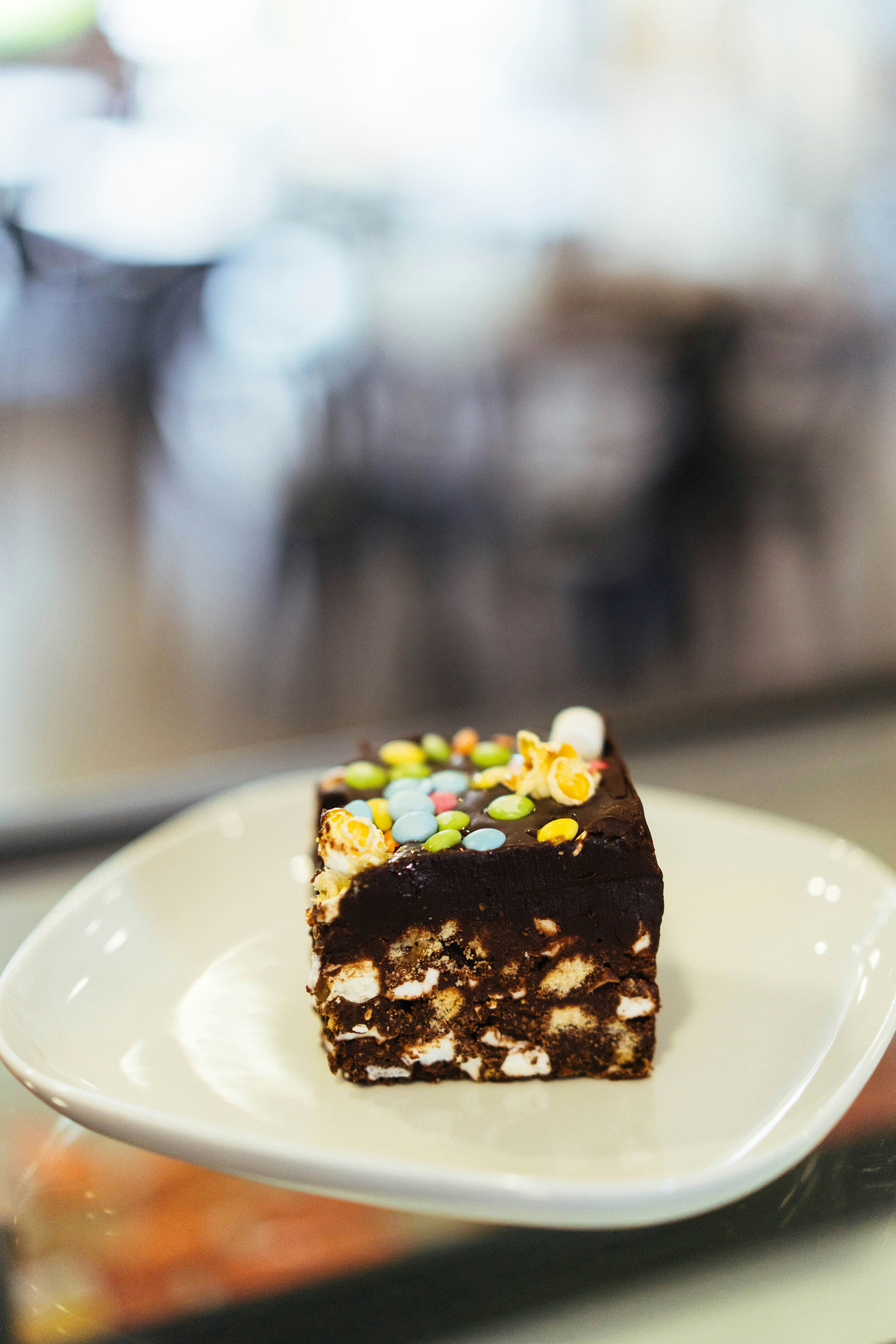Glossy Chocolate Slice on a White Plate