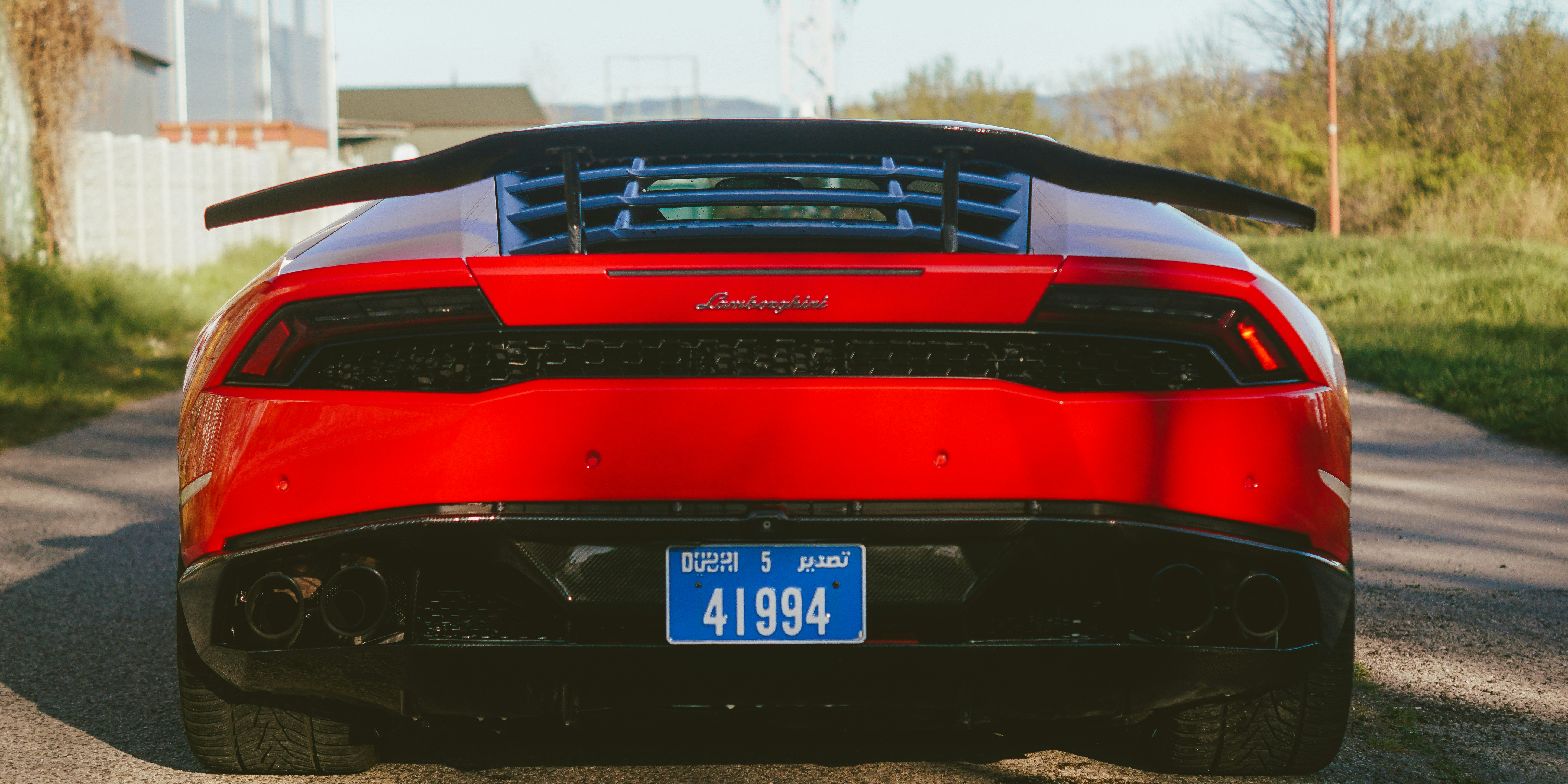 Rear View of a Red Lamborghini Huracán: Nightshade in Motion