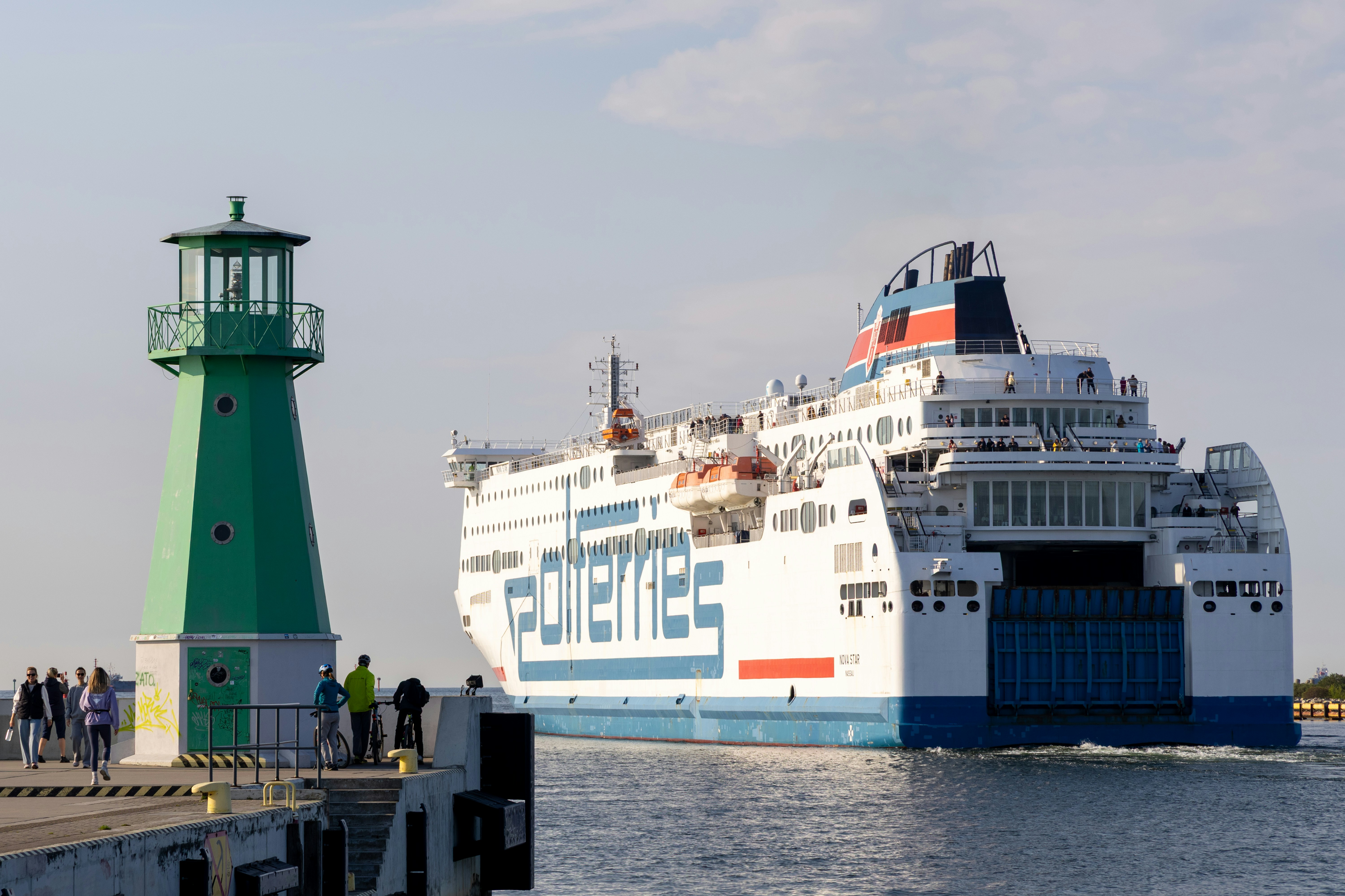 Green Lighthouse and White Ferry: Quiet Harbor Welcome