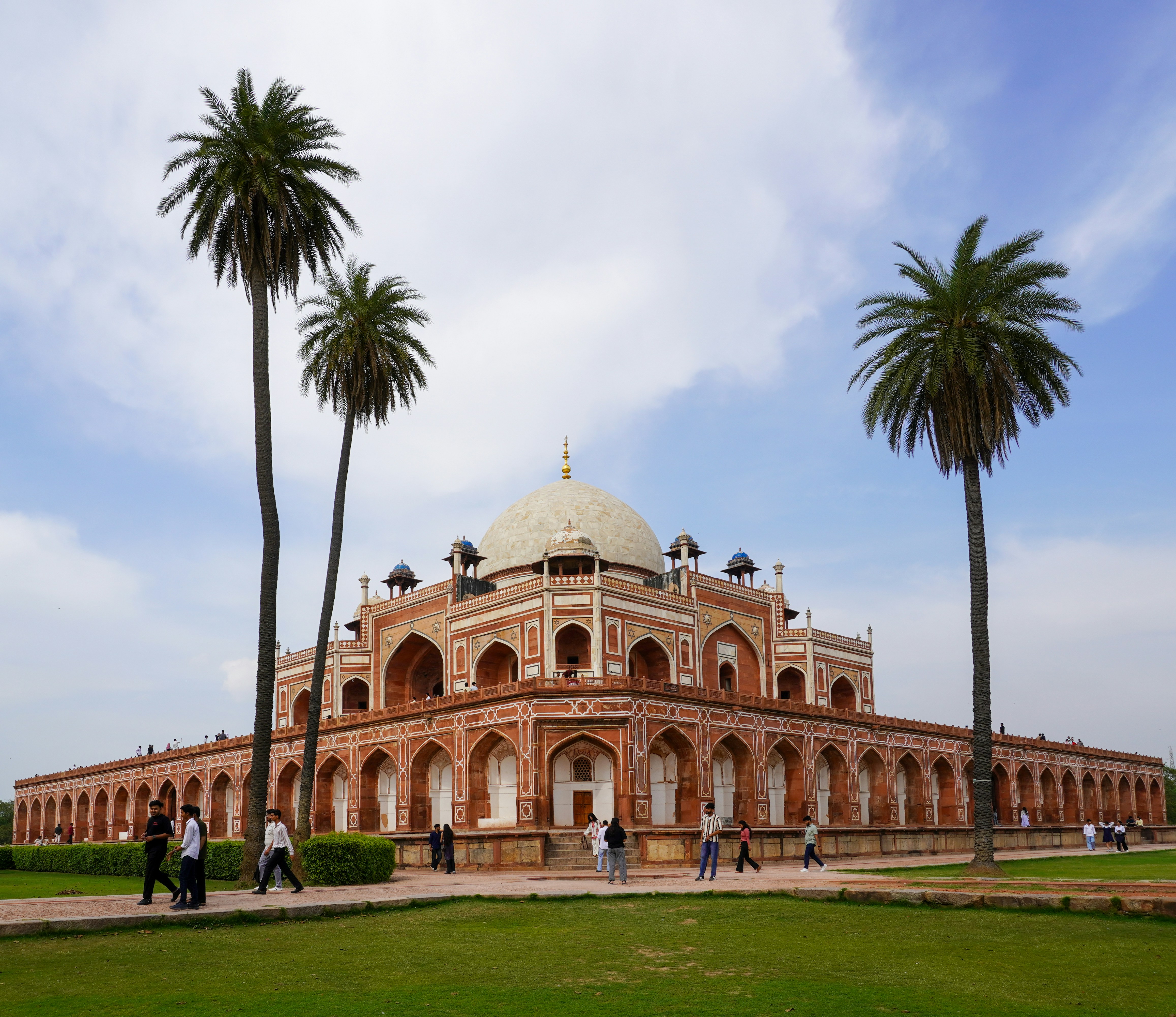Charms of the Mughal Dome: A Palatial Corridor Framed by Year-Round palms