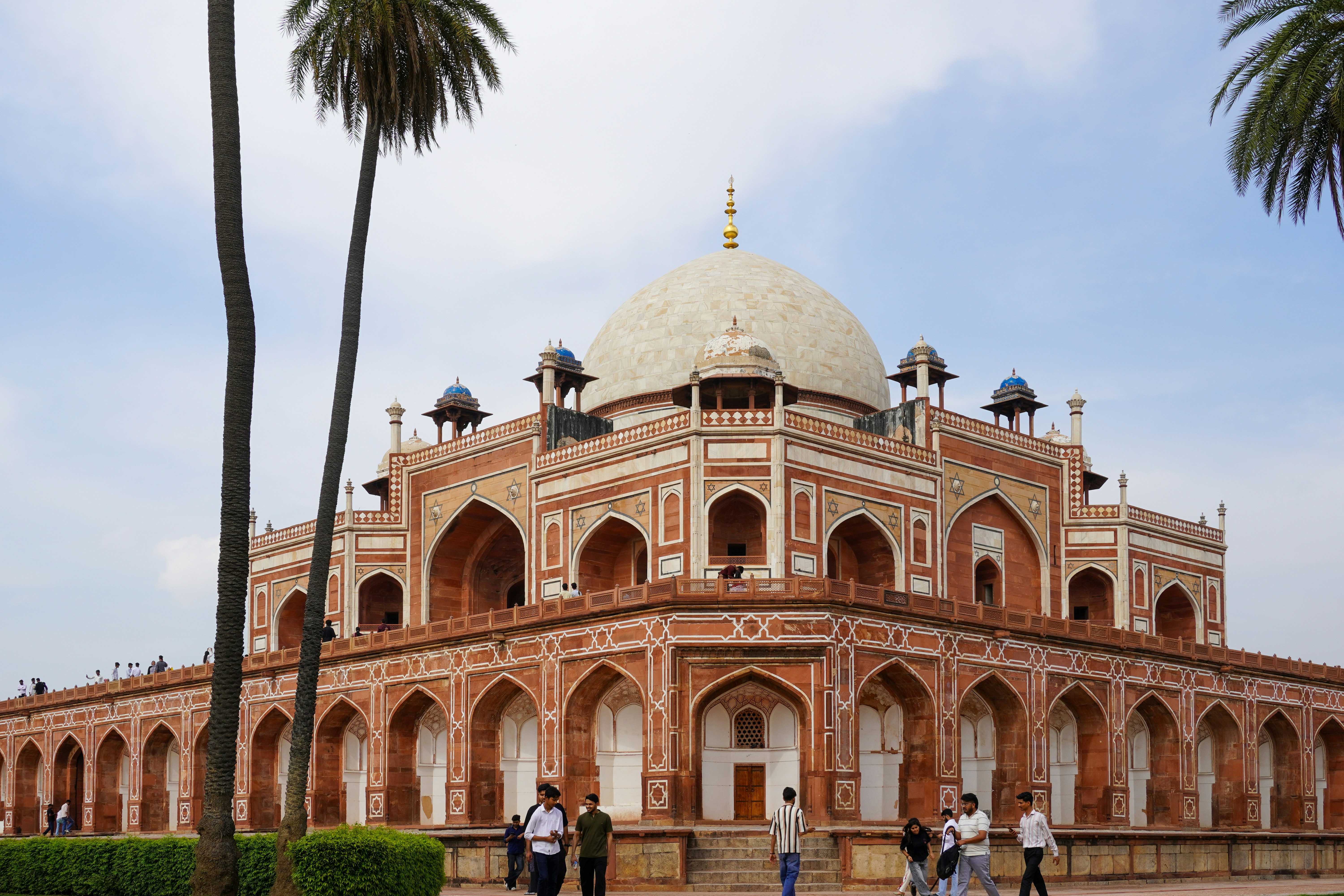 Domed Majesty: The Taj from a Palm-Lined Forecourt