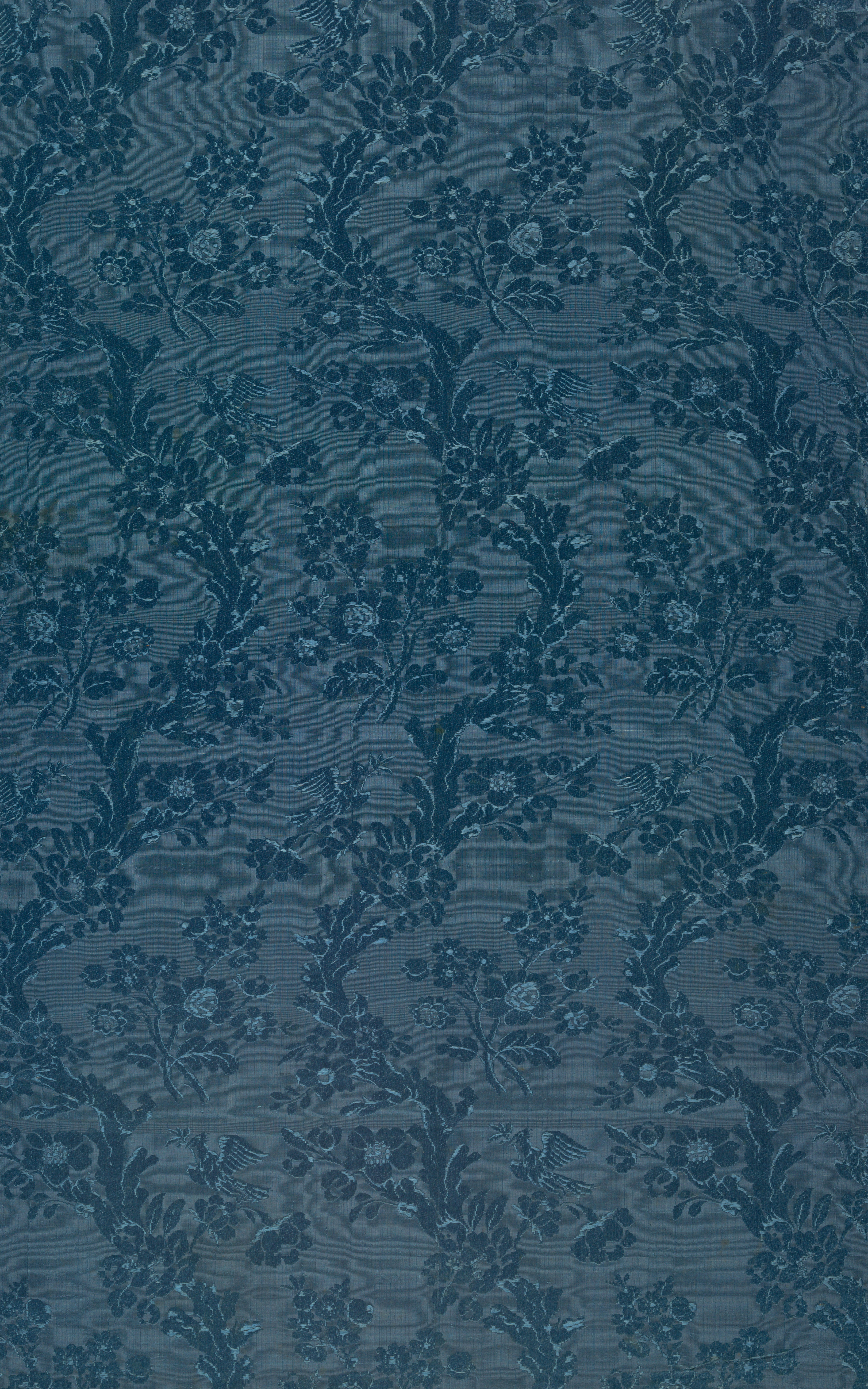 Damask in Indigo: Repeating Floral Pattern on Textured Fabric