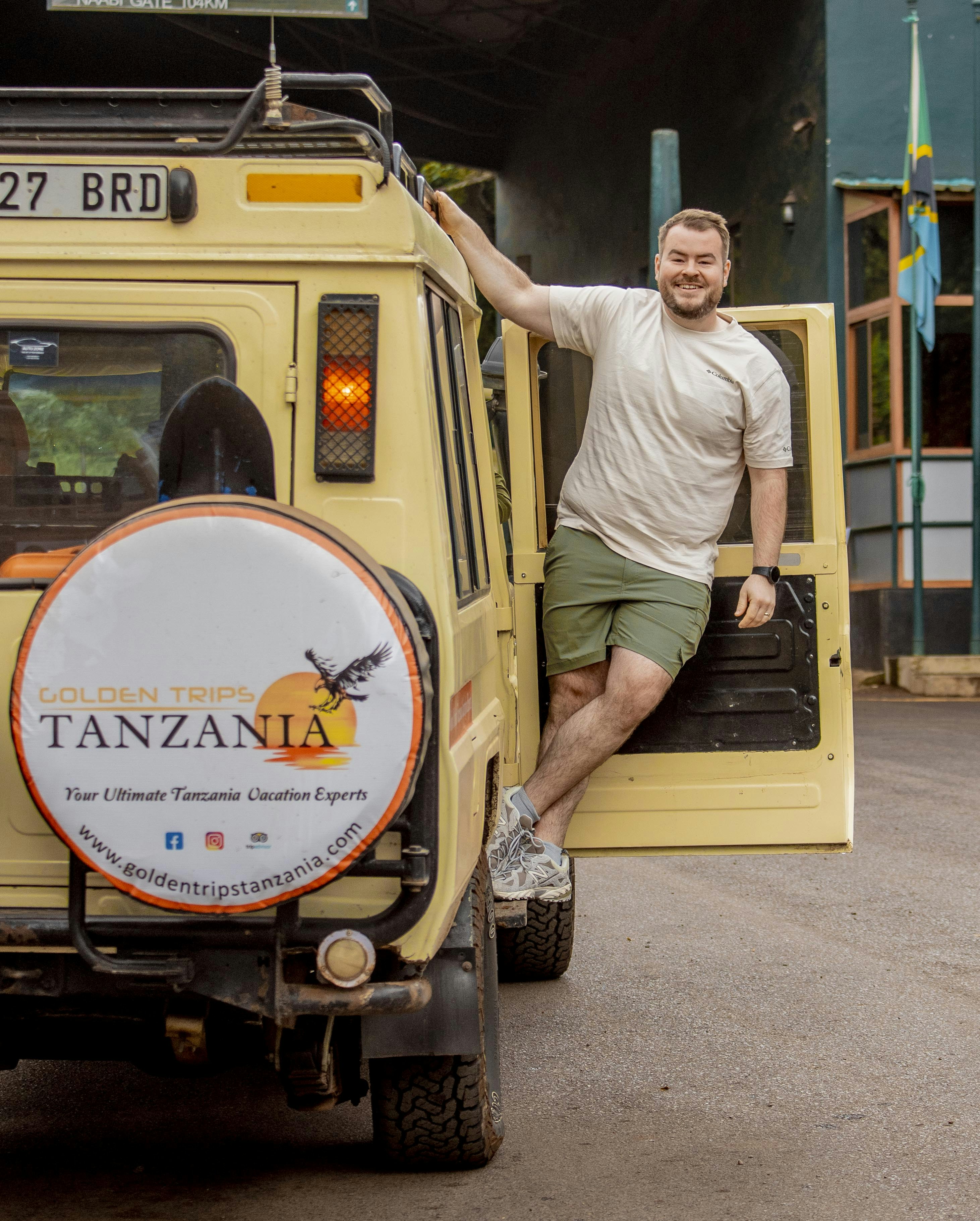 Driver in the Yellow 4x4: A Tanzania Tour Stop
