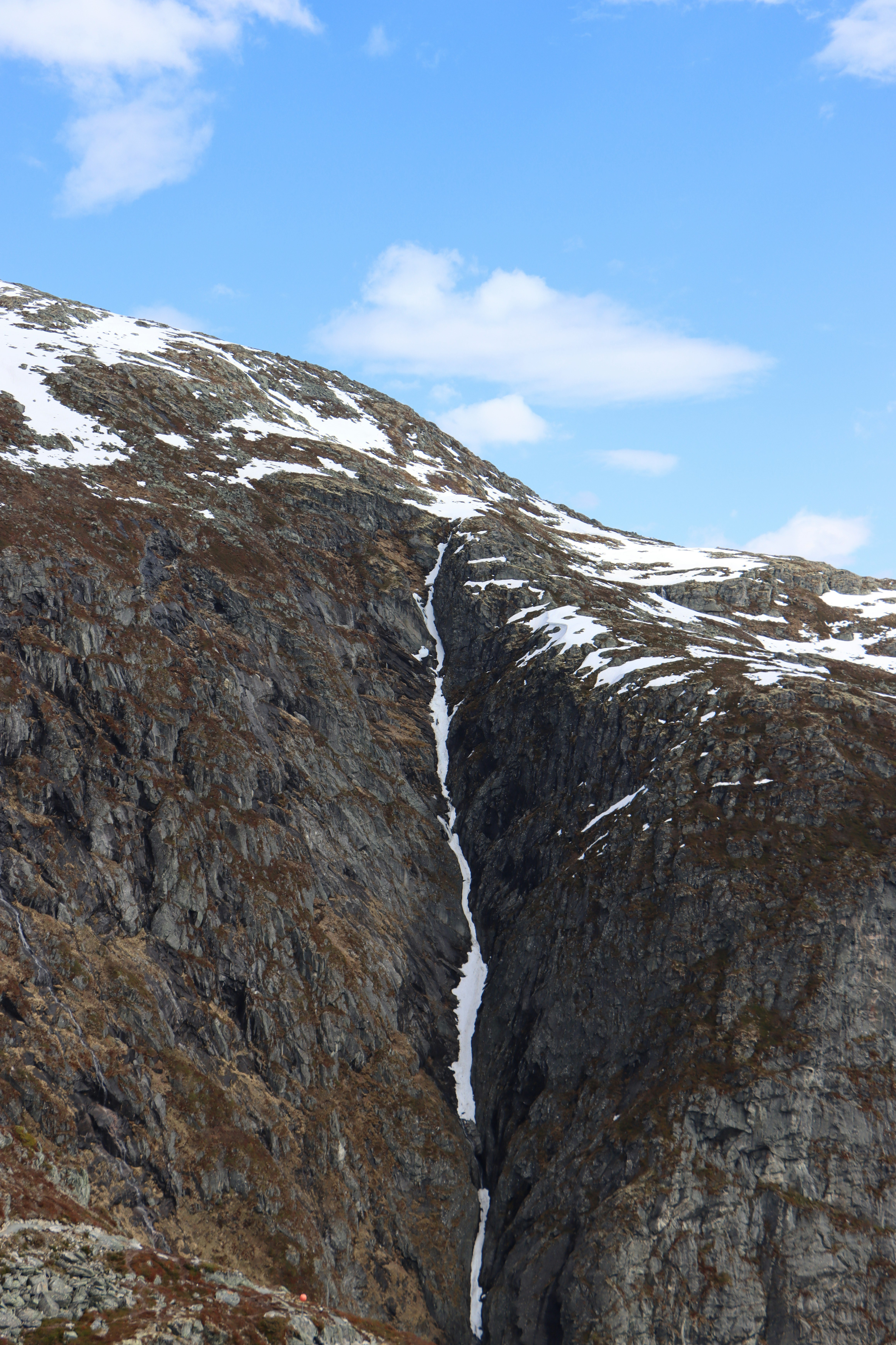Snow-veined chasm between jagged peaks