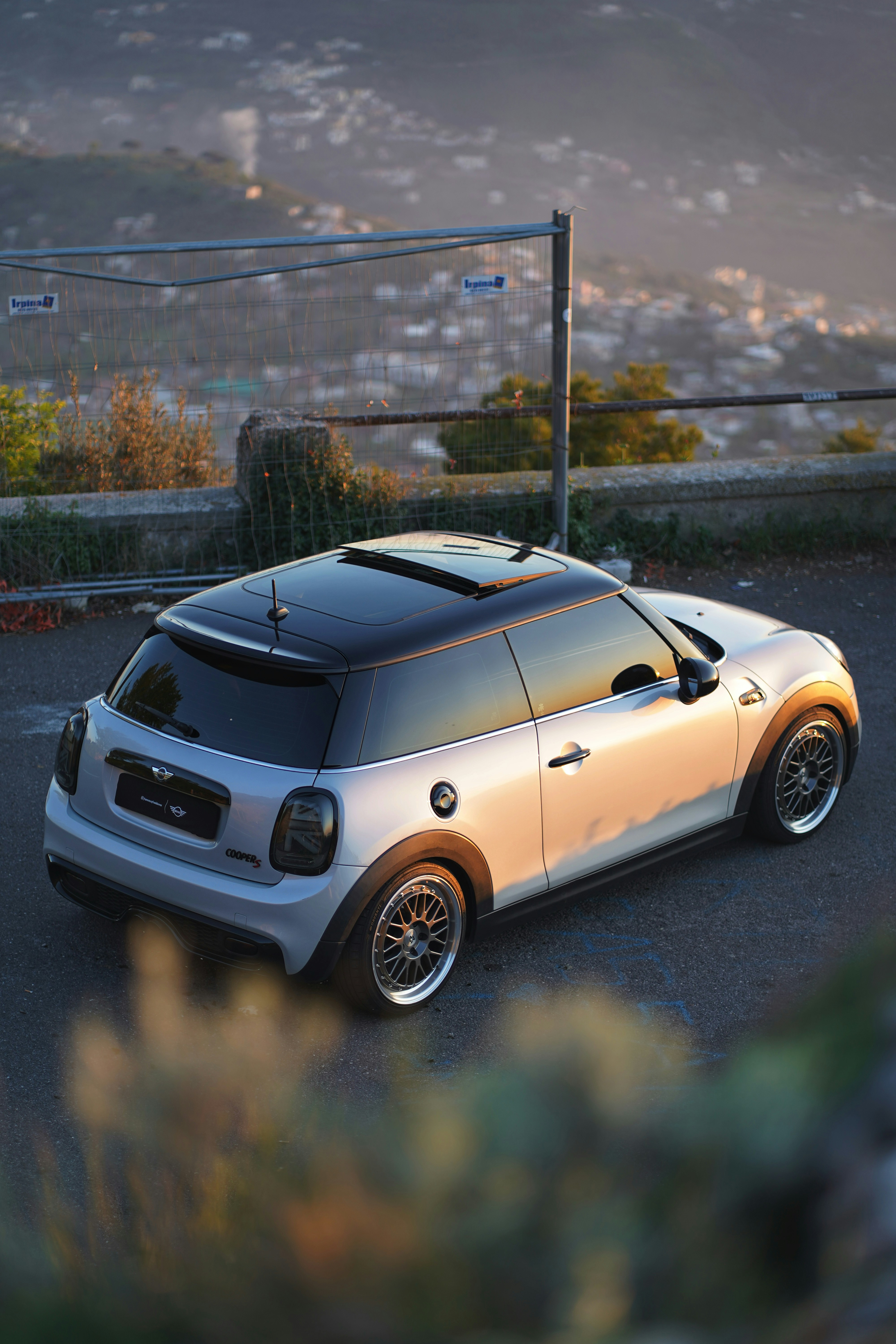 Silver Microcar in Golden Hour Climb