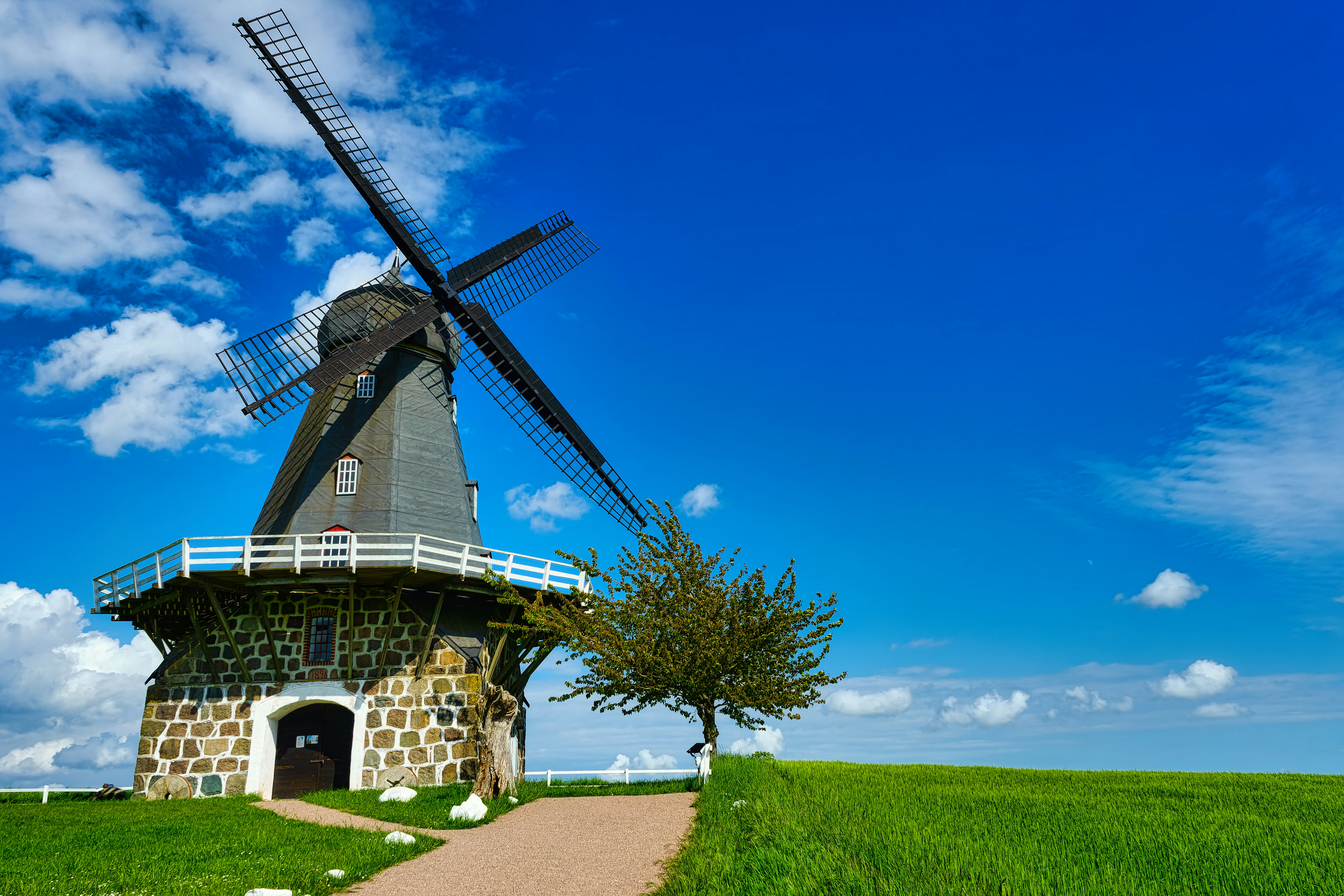 That Windmill Stands Guard Over the Green Horizon