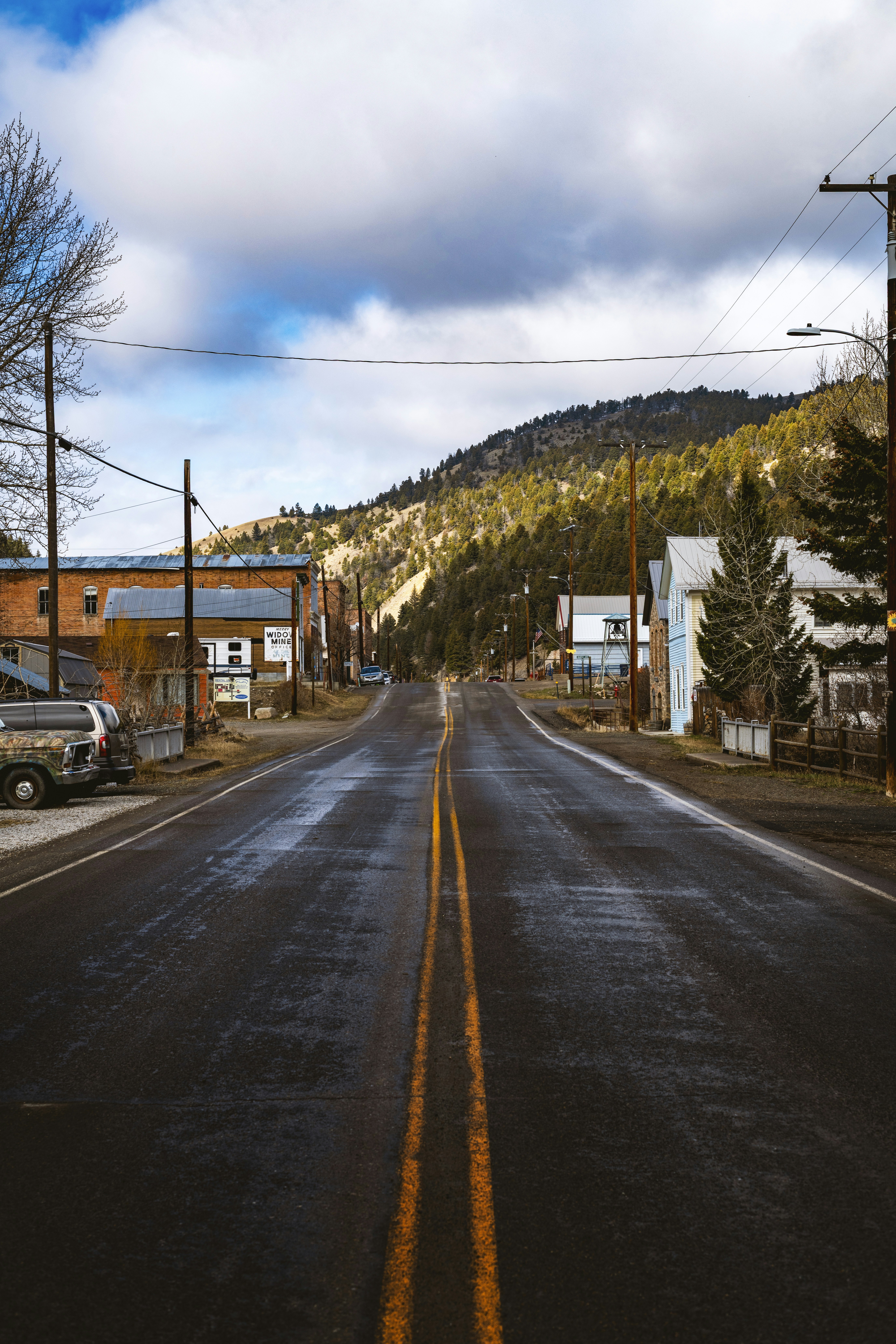 Empty road stretching through a rustic mountain village. photo – Free ...