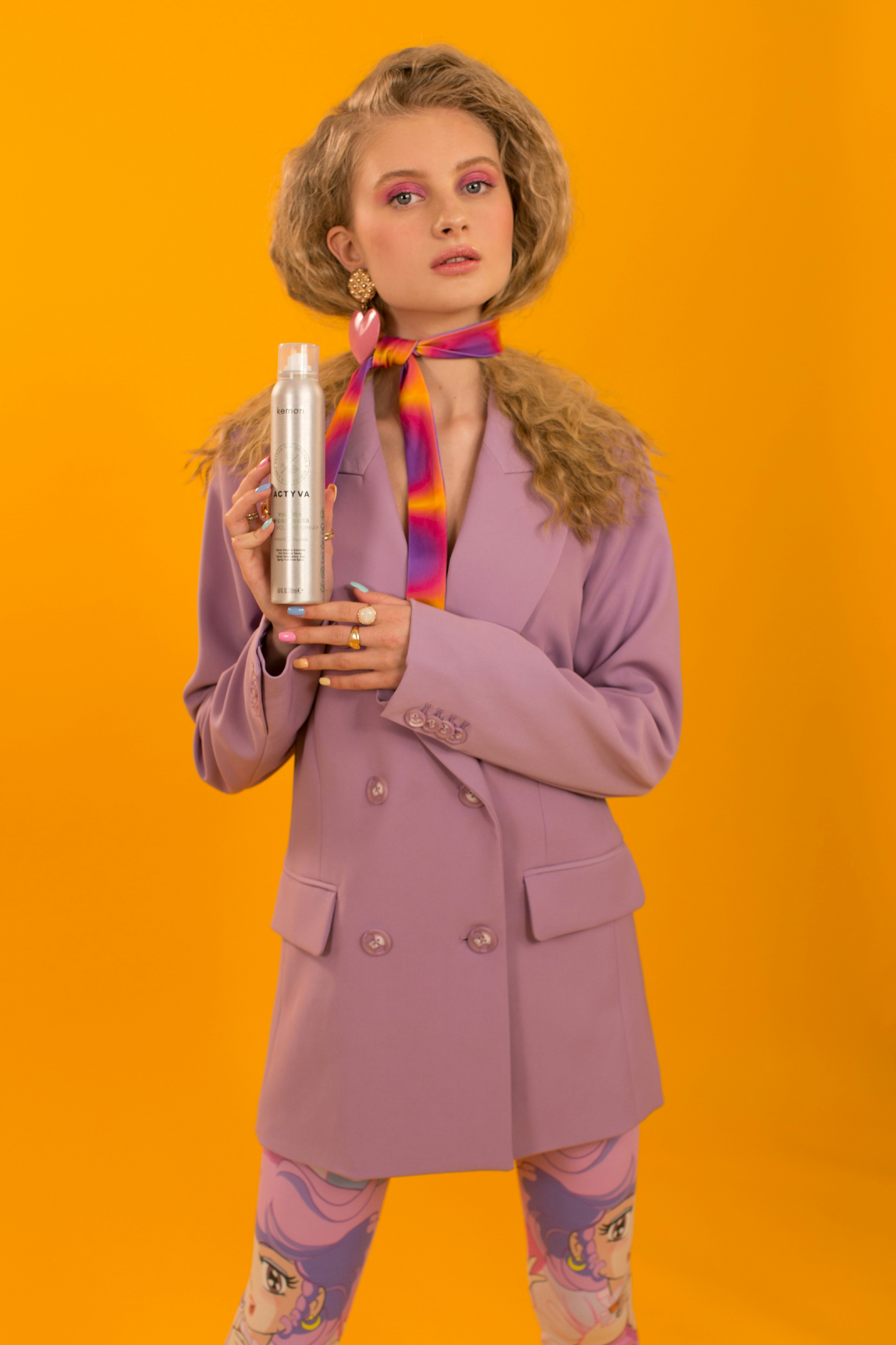 Neon-Orange Backdrop, Lavender Suit: A Portrait in Pop Color