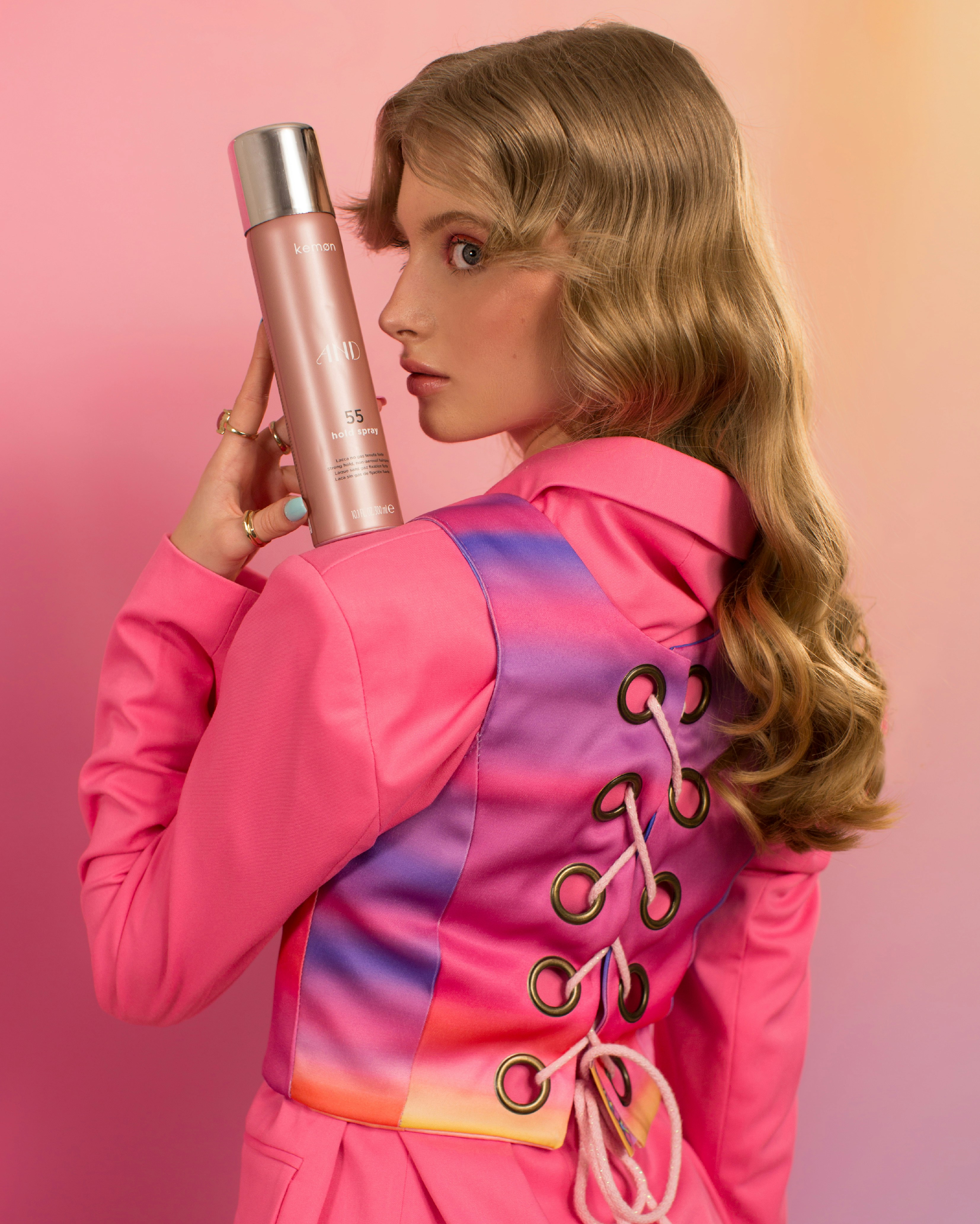Pink Spotlight: A Portrait with Vintage Glamour and a Metallic Spray