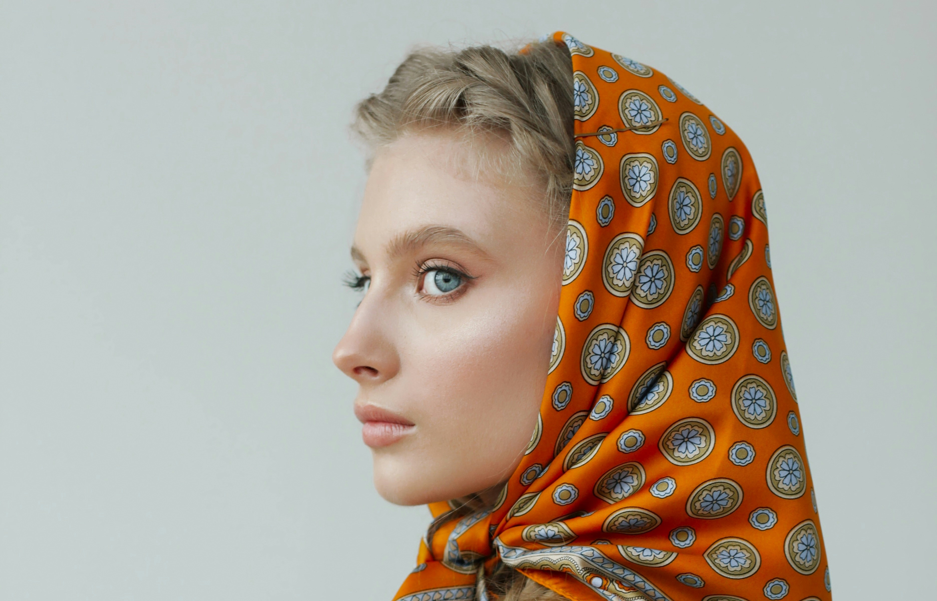 Amber Veil: A Portrait Wrapped in Patterned Silk