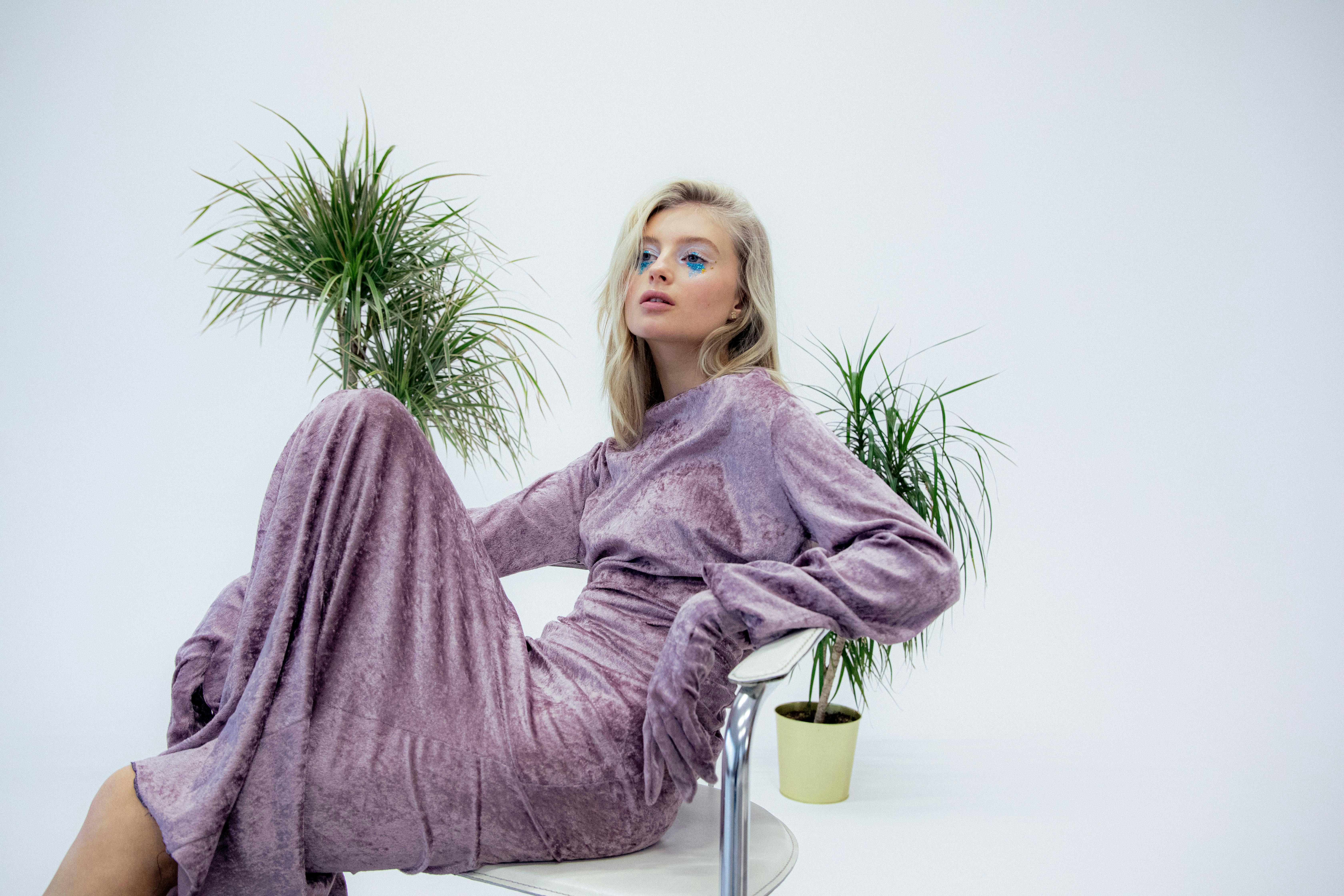 Lavender Velvet: A Poised Portrait on a Minimal Set