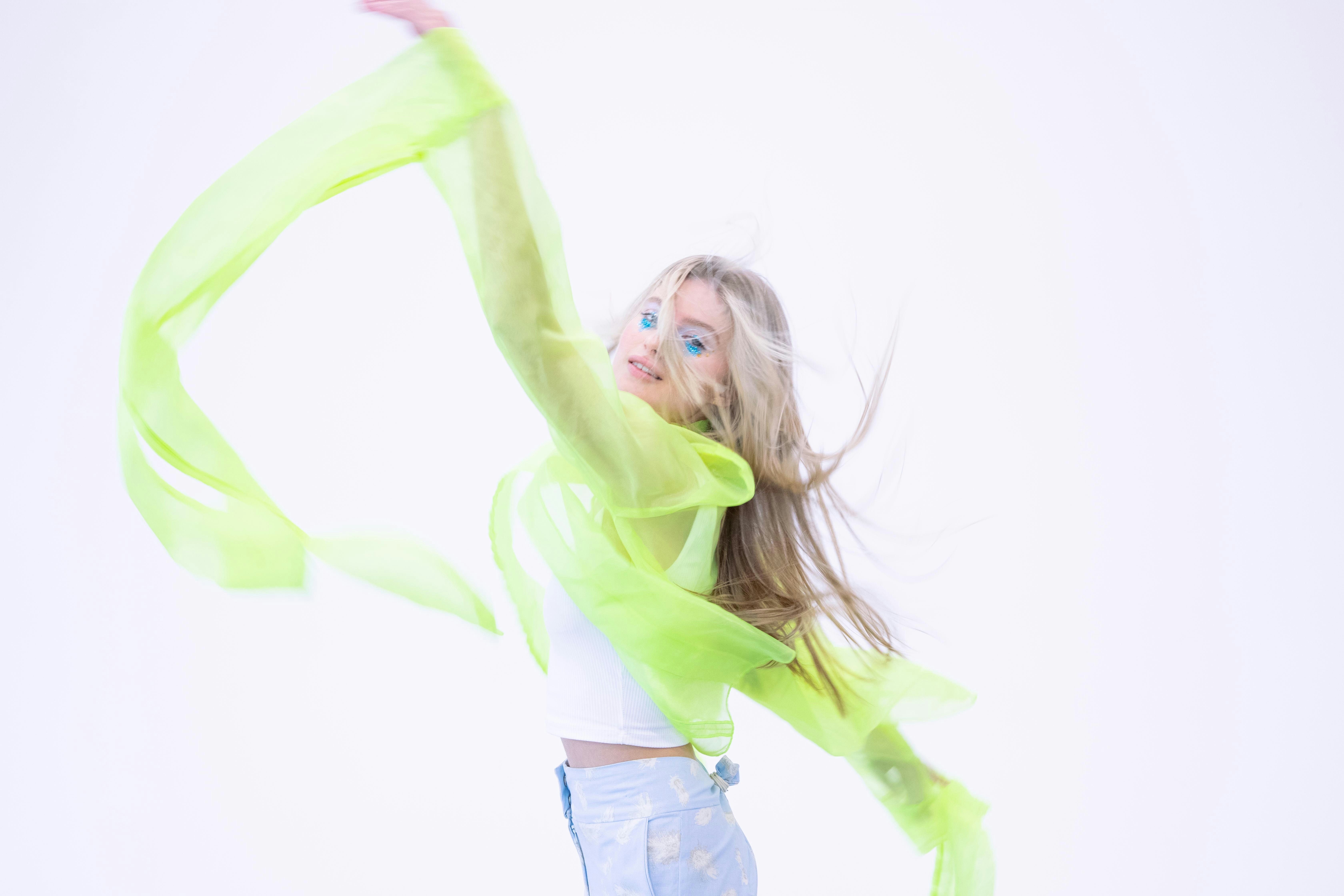 Emerald Silk in Motion: A Fluid Portrait of Light and Wind