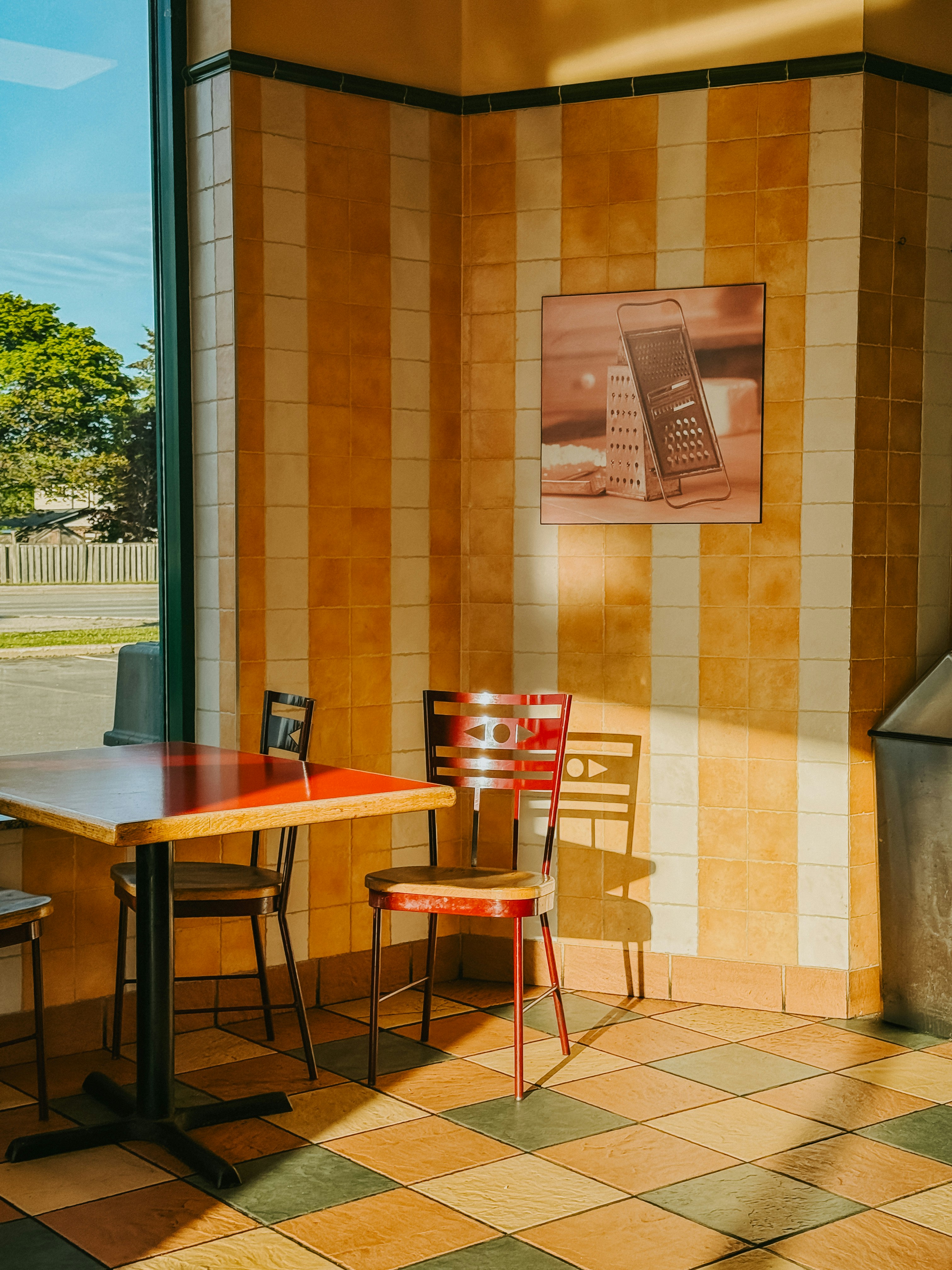 Sunlit Corner Café: A Quiet Moment by the Checkerboard Tiles
