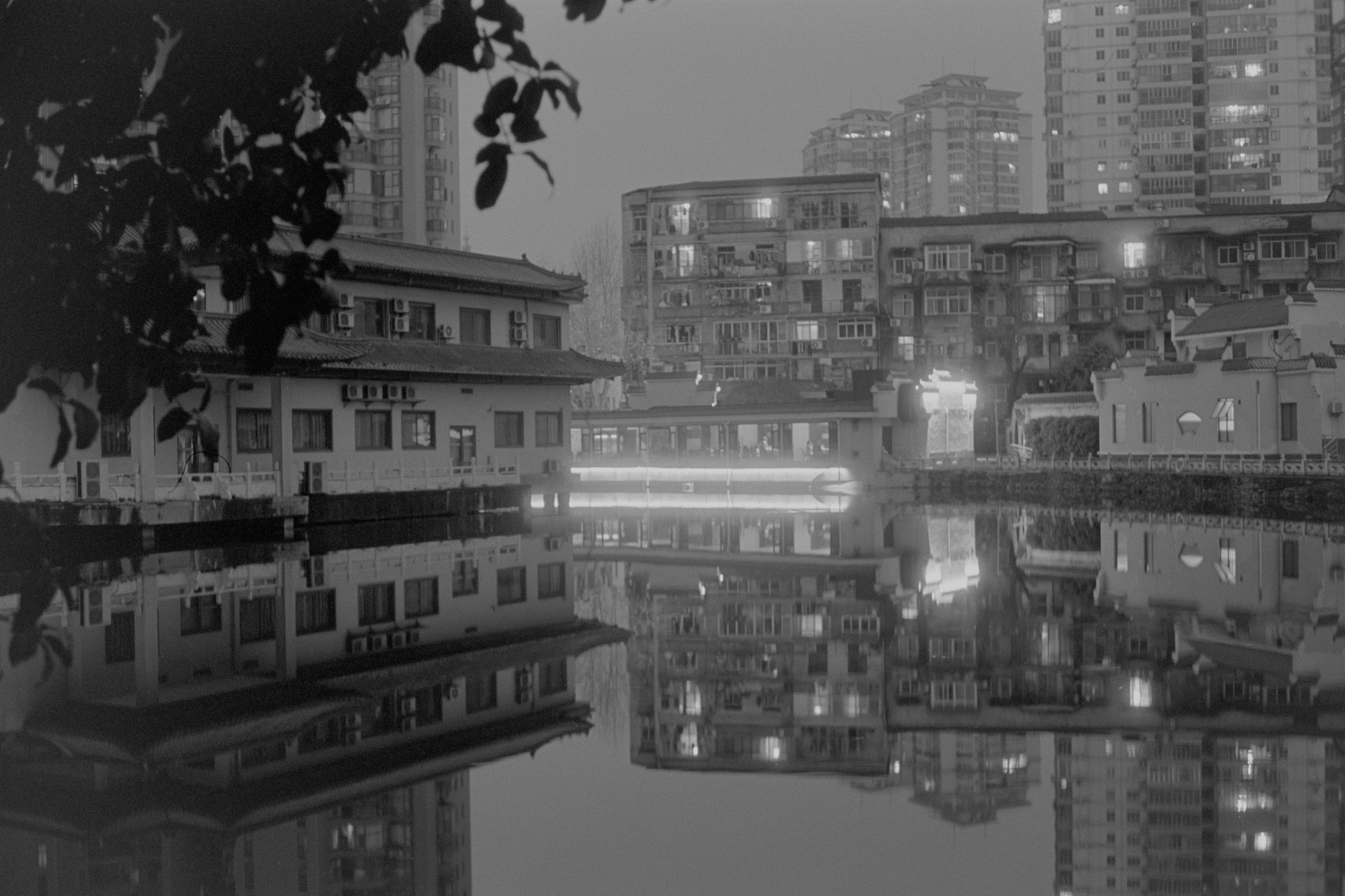 Twin City Lights Reflected: Nighttime Canal Mirror