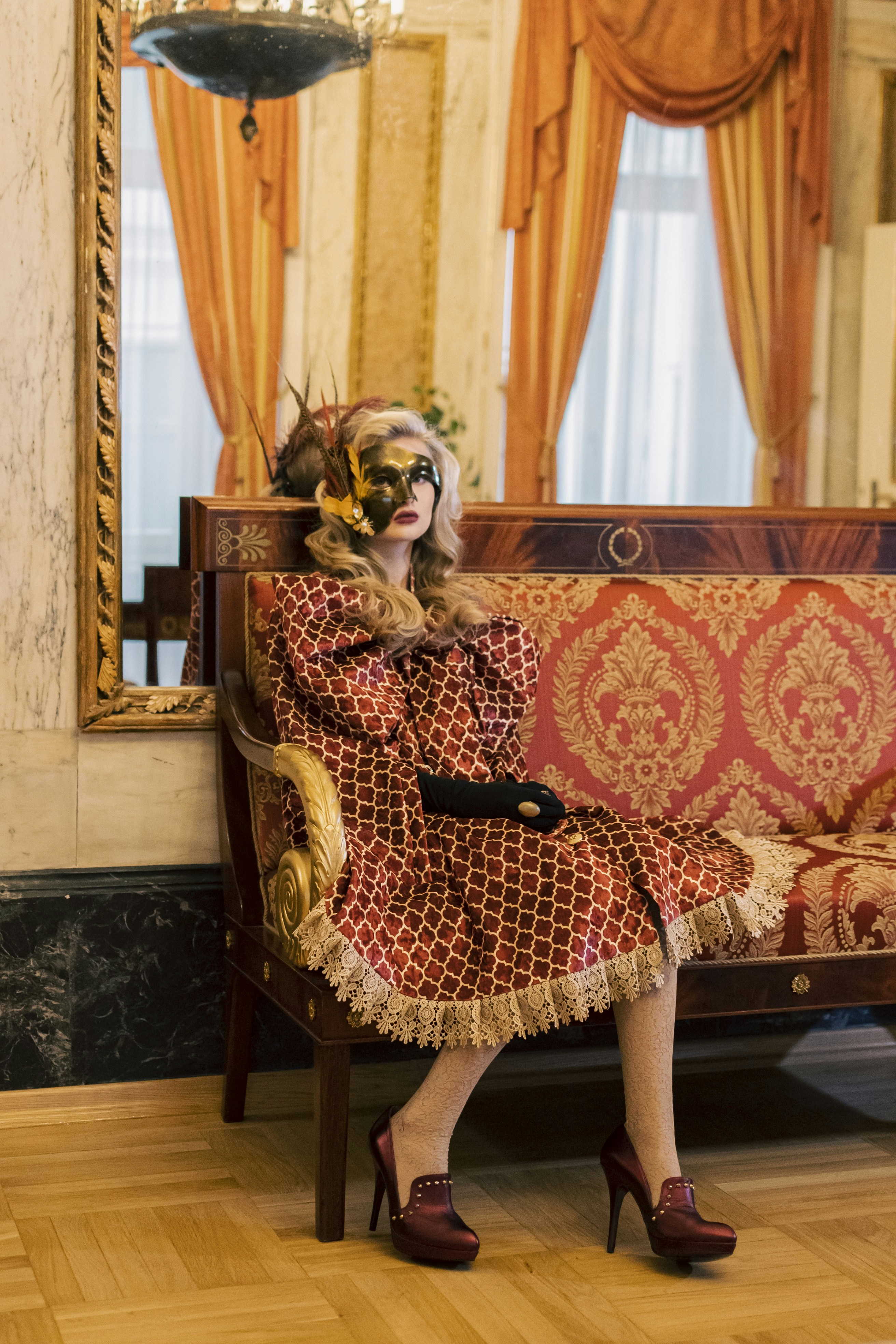 Masked elegance on a gilded velvet throne
