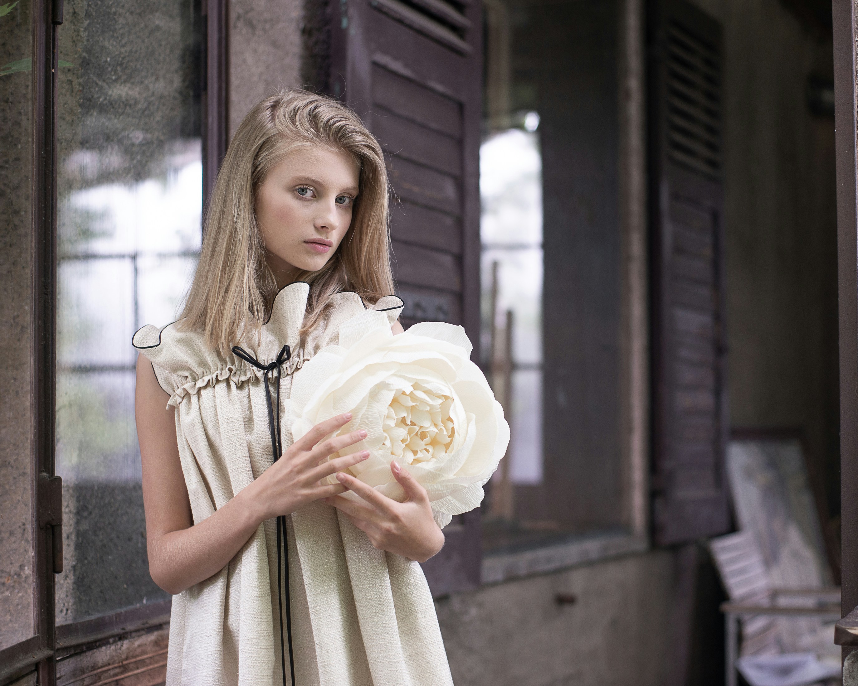 Soft Portrait with a White Rose in Quiet Factory-Window Light