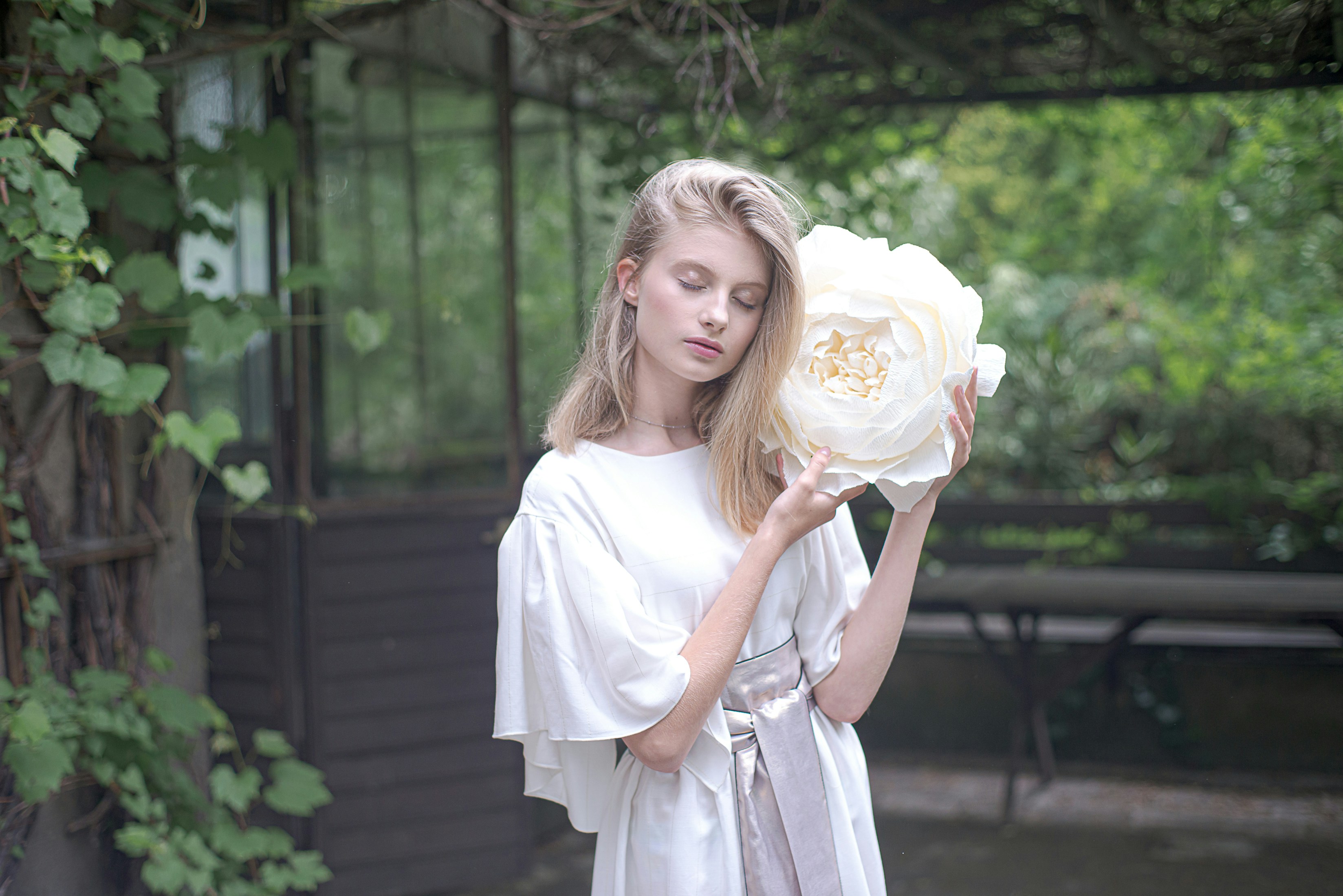 Portrait in Bloom: A Soft Moment with a White Rose