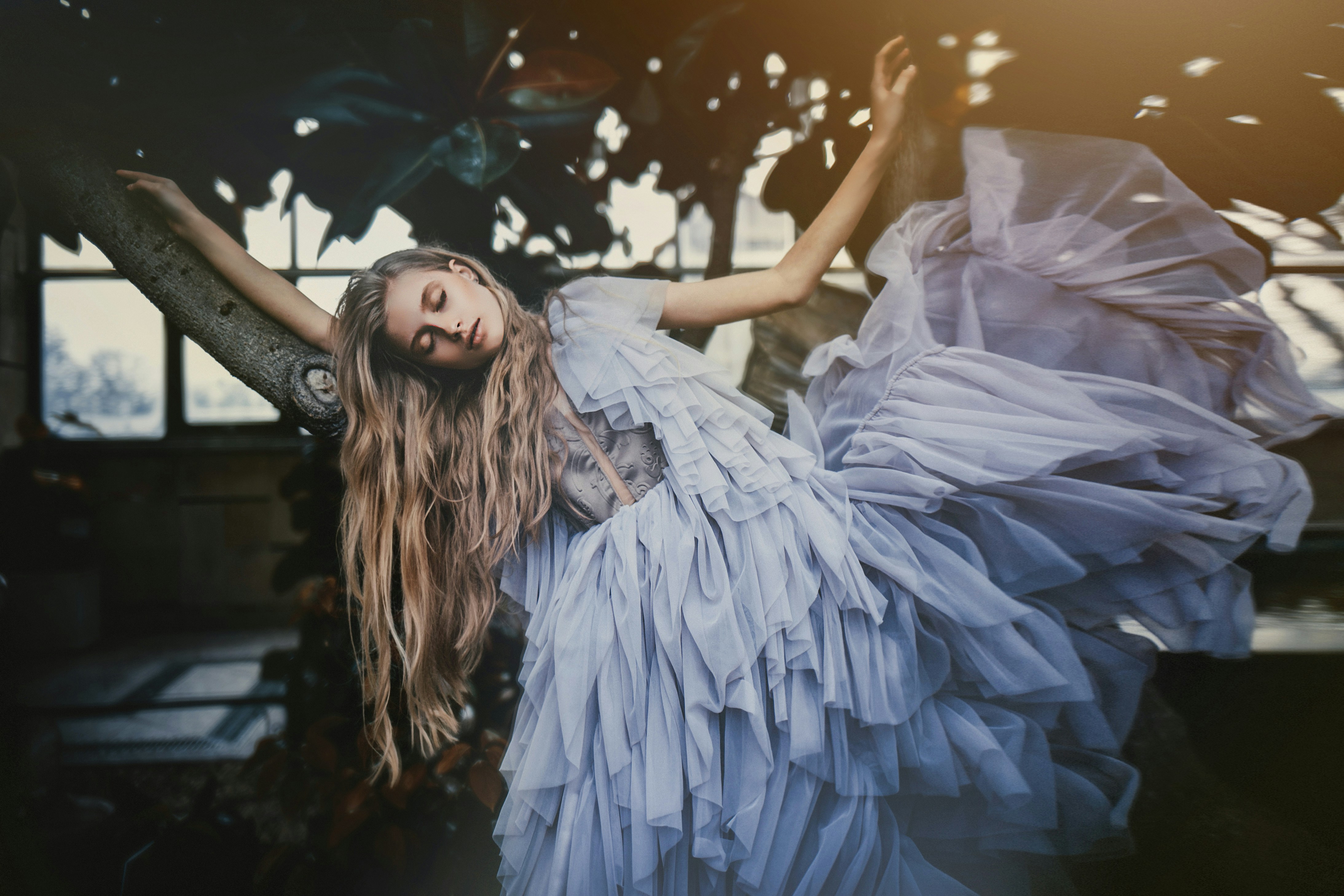 Fluid Silk in Motion: A Dreamlike Pose on a Shaded Stage
