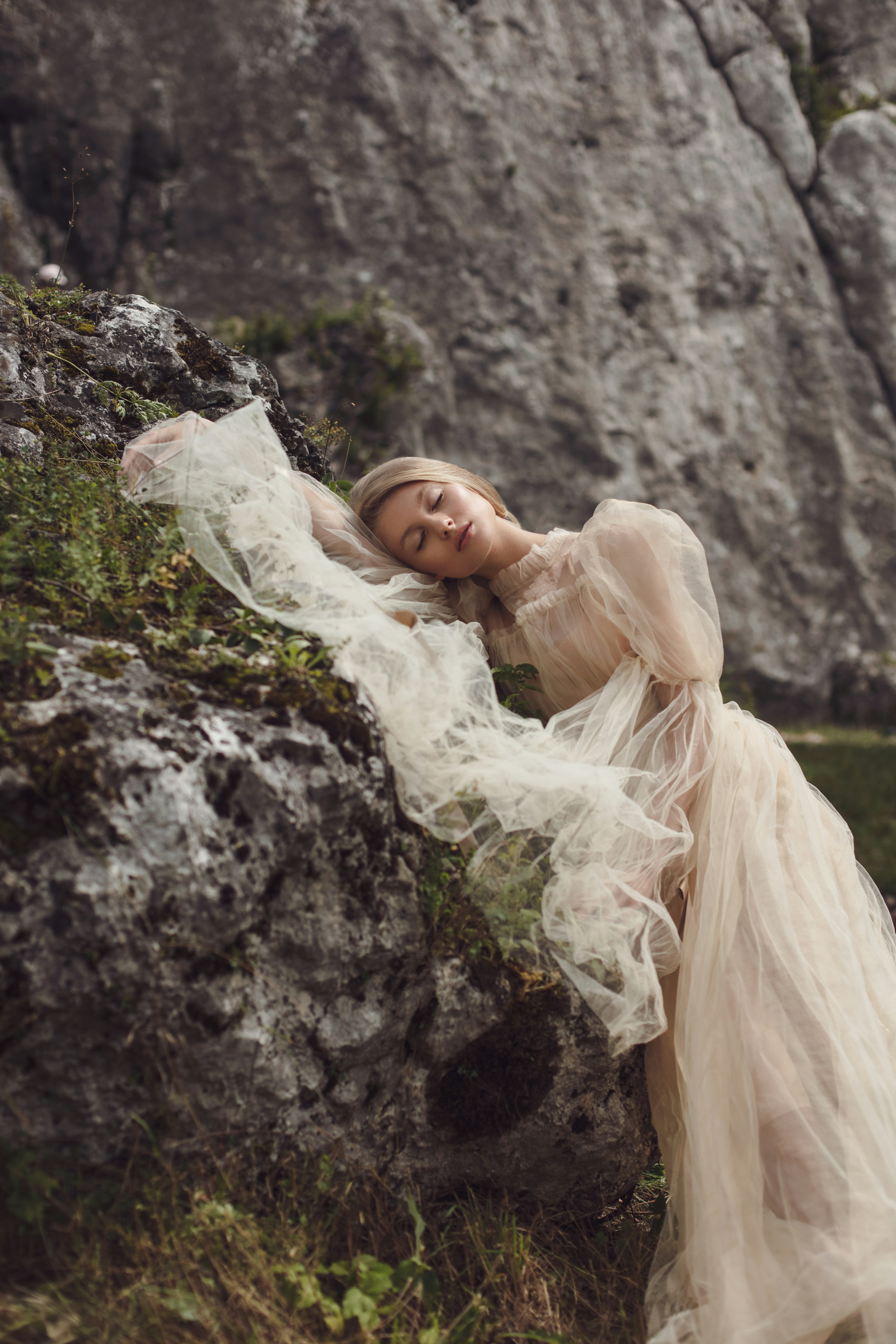 Soft Repose on Granite: A Dreamlike Portrait with Delicate Lace