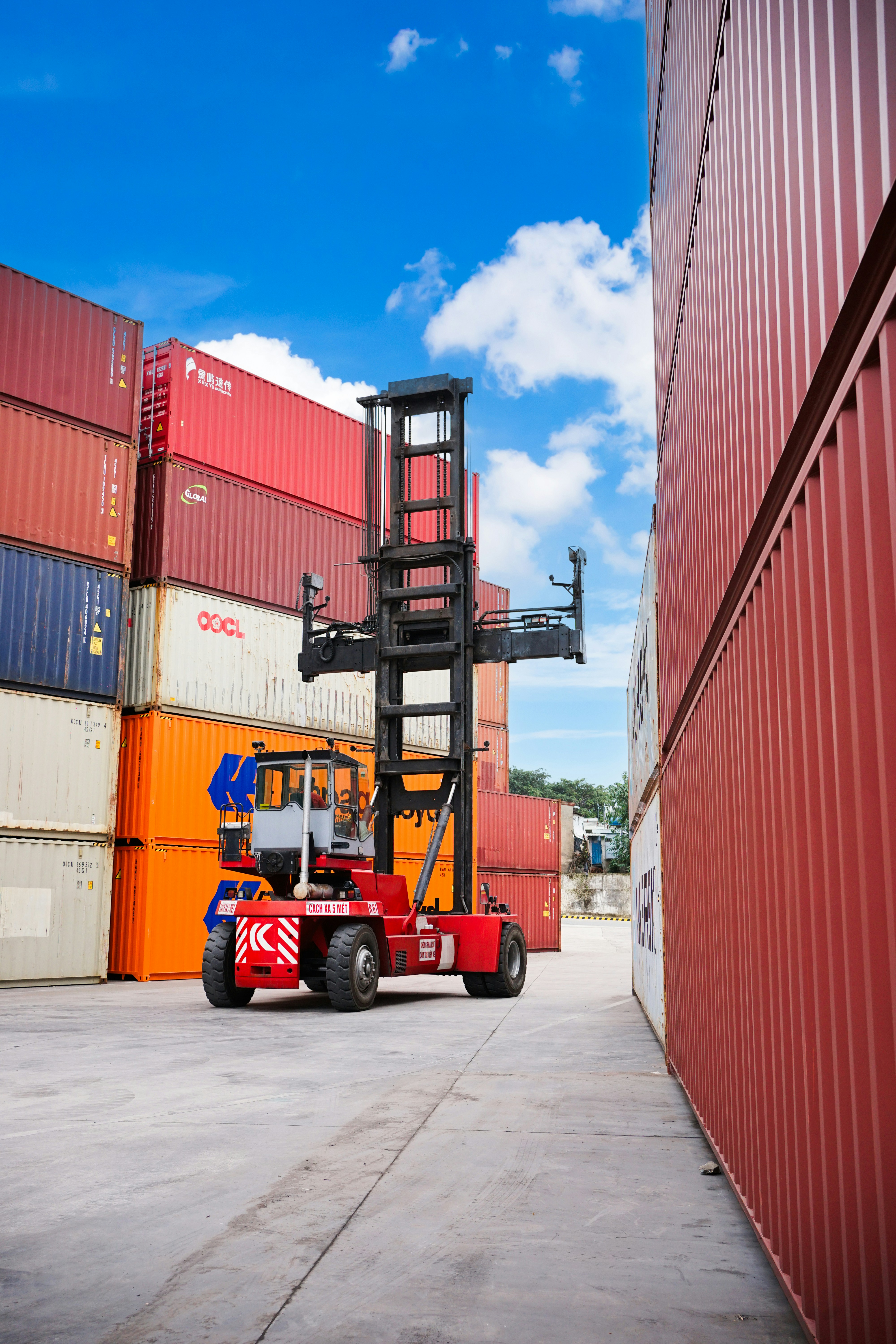 Crane Train of Containers: A Dockside Maneuver Under Blue Skies