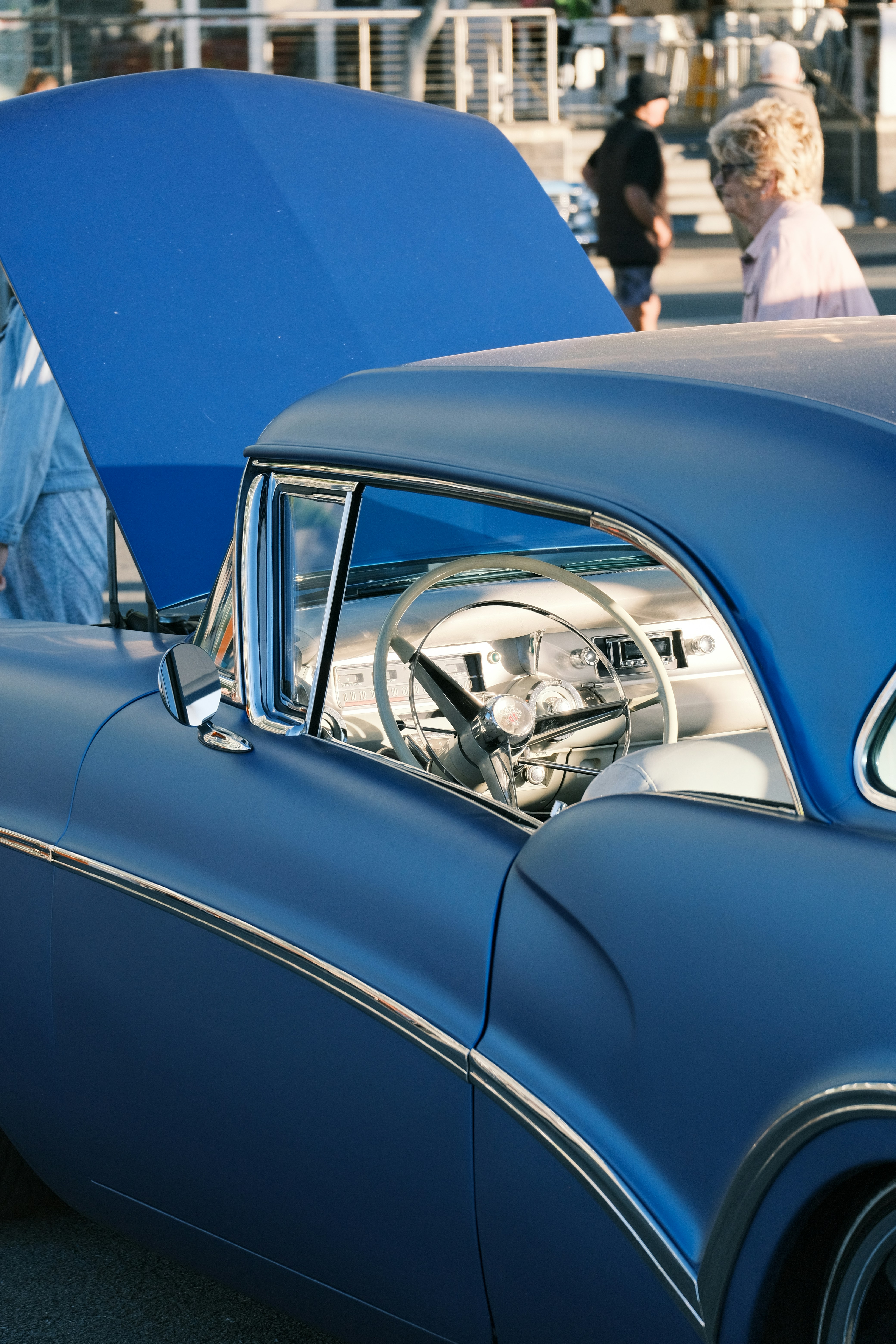 Blue Classic: The Car’s Silken Curves Under an Open Hood