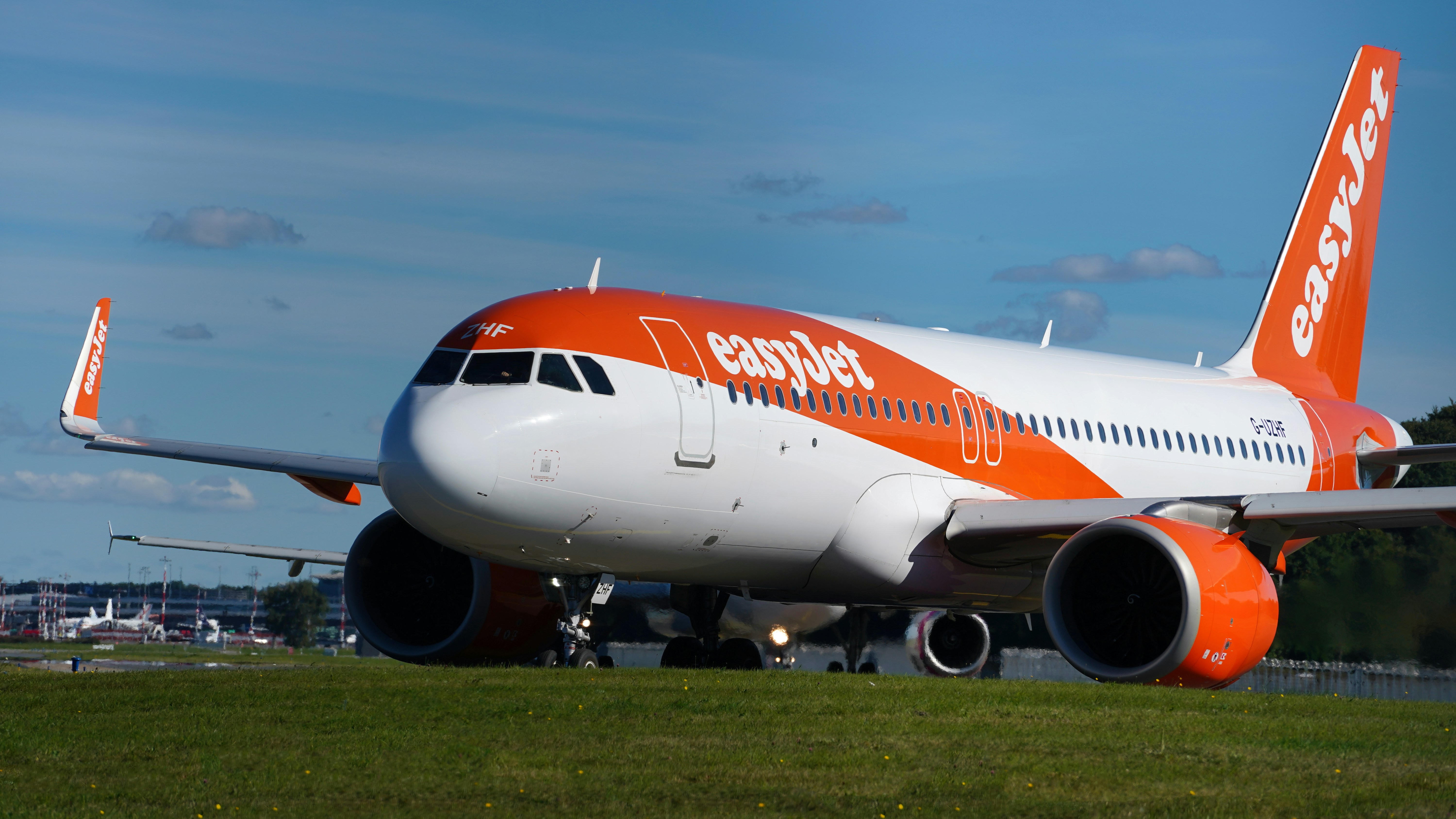 Orange Arrow on the Runway: A parked EasyJet A320 Ready for Departure