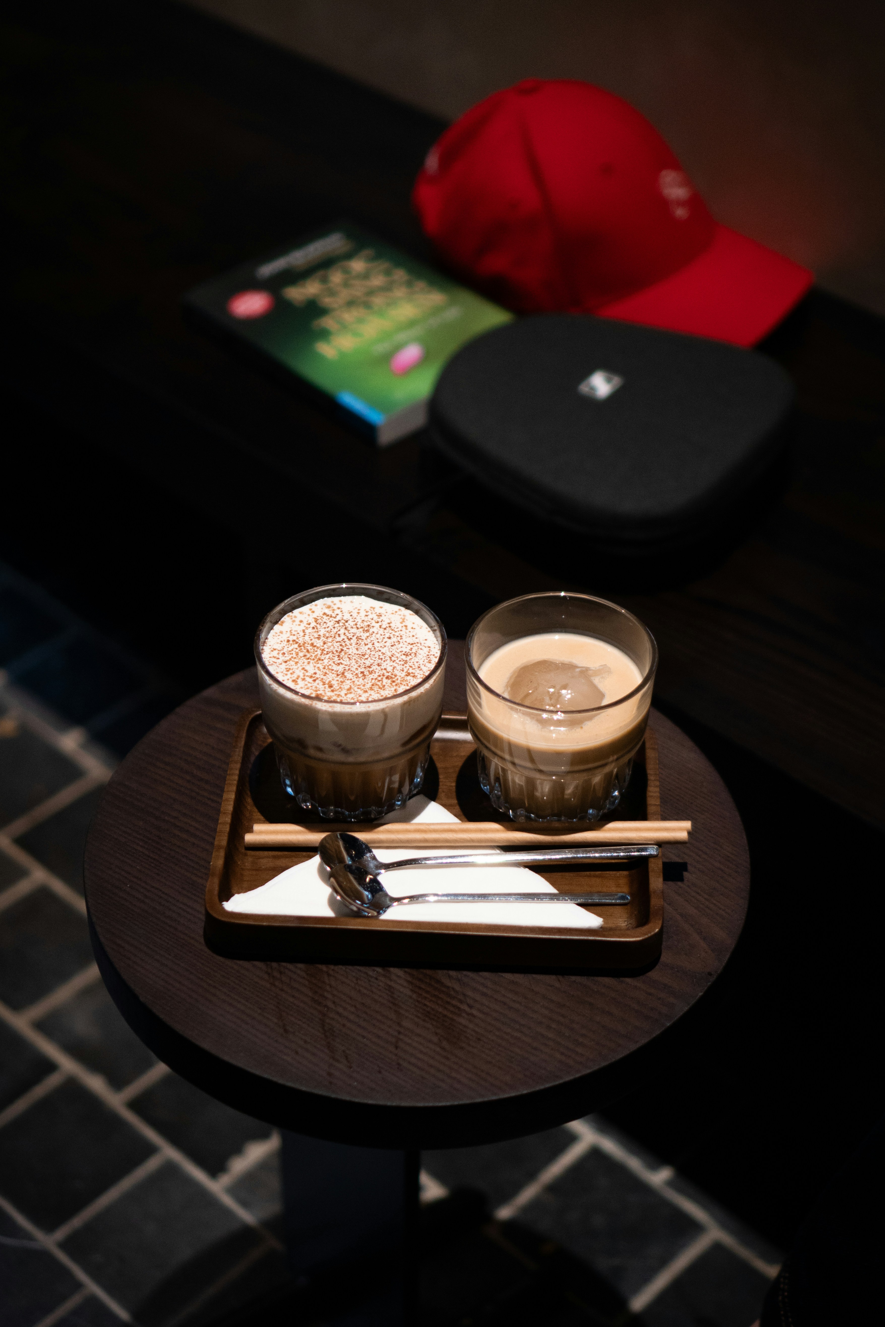 Two Coffee Glasses on a Rustic Table with Tasting Tray