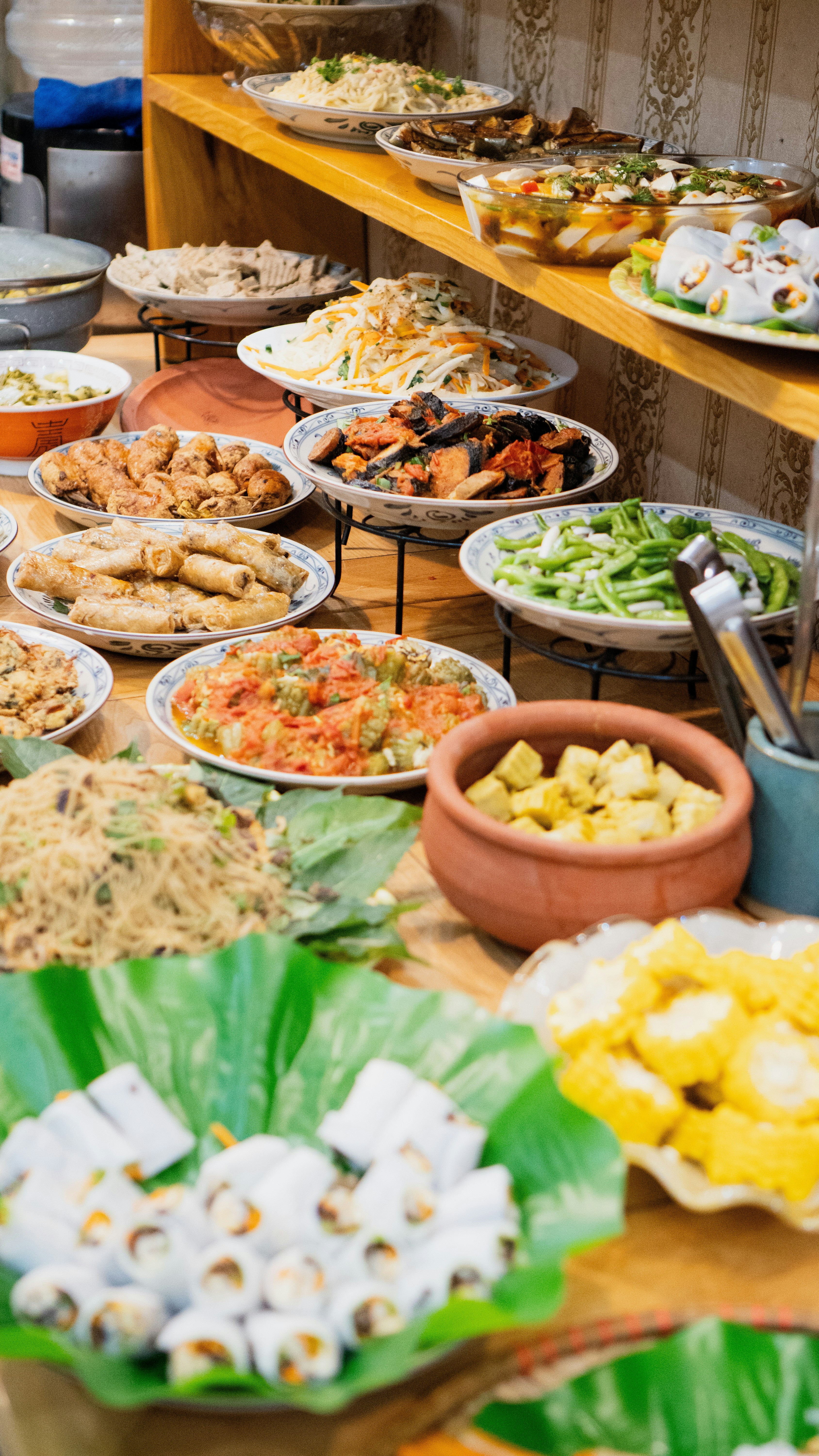 A Colorful Cantonese Buffet Spread: Plates of Dumplings, Greens, and Roasted Delights