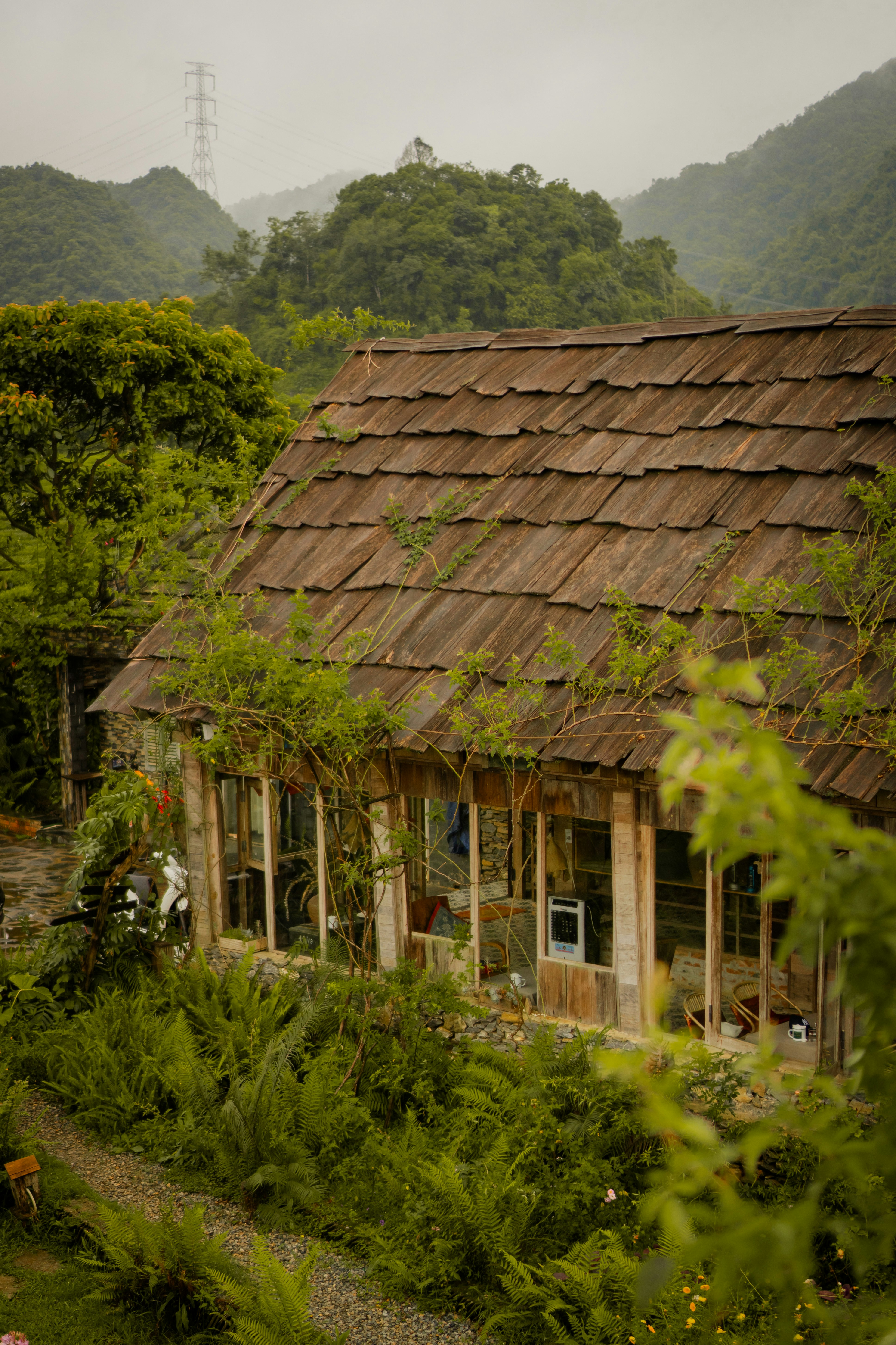 Rustic Roofscape: A Courtyard Beneath Verdant Hills