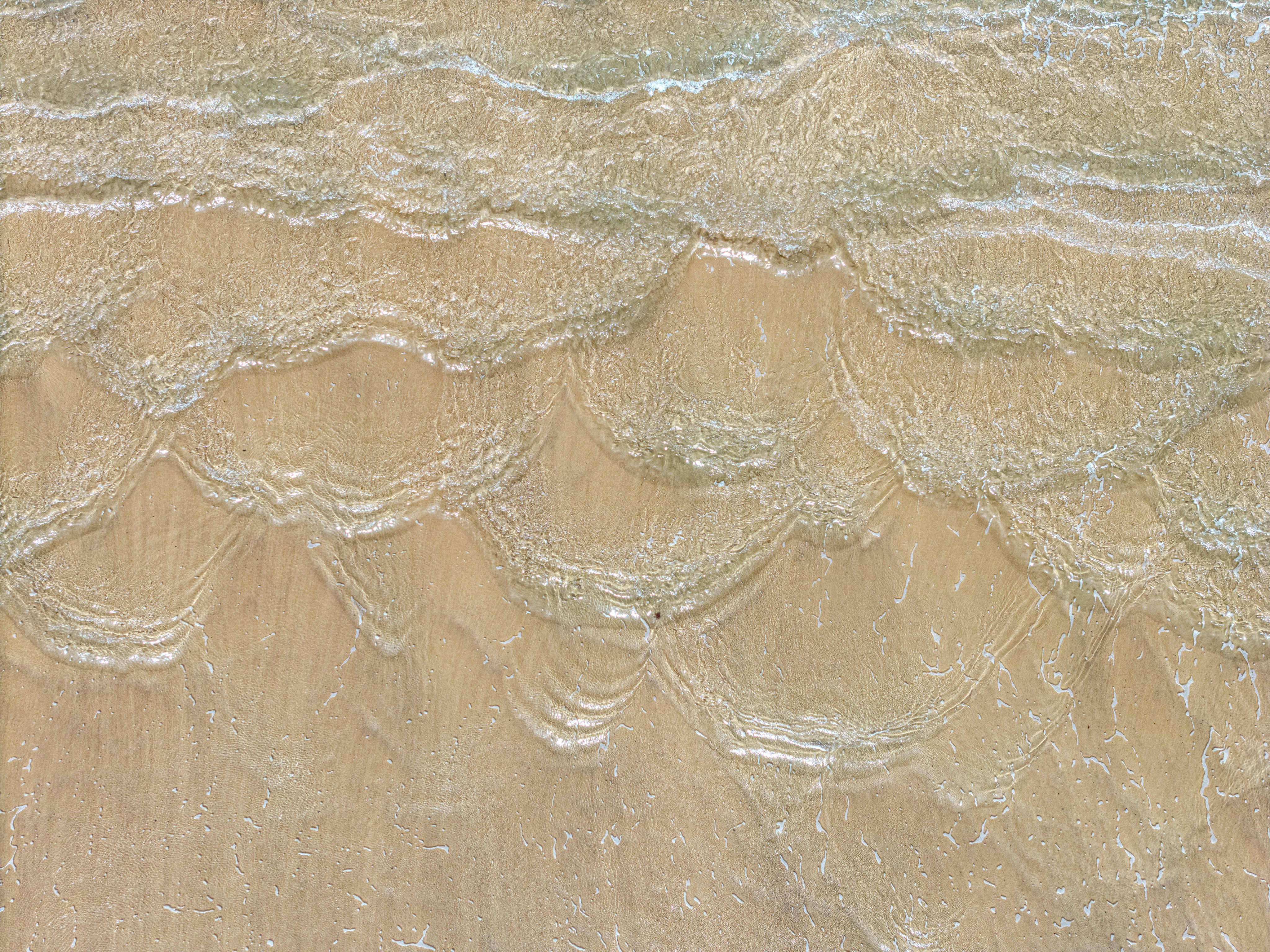 Top-Down Tide: Close-Up of Pebbled Shoreline Patterns