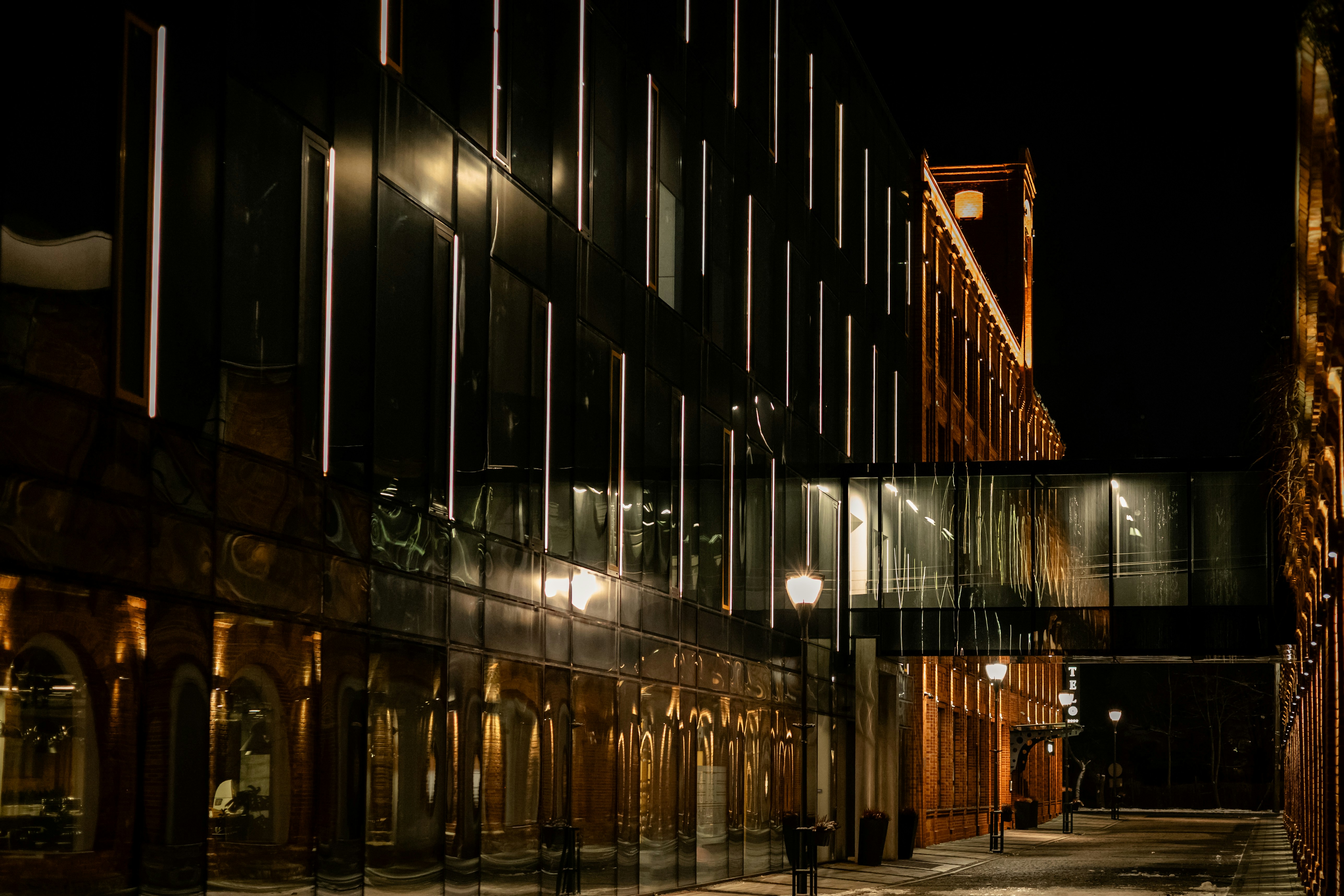 Night Walkways beneath Glass and Steel