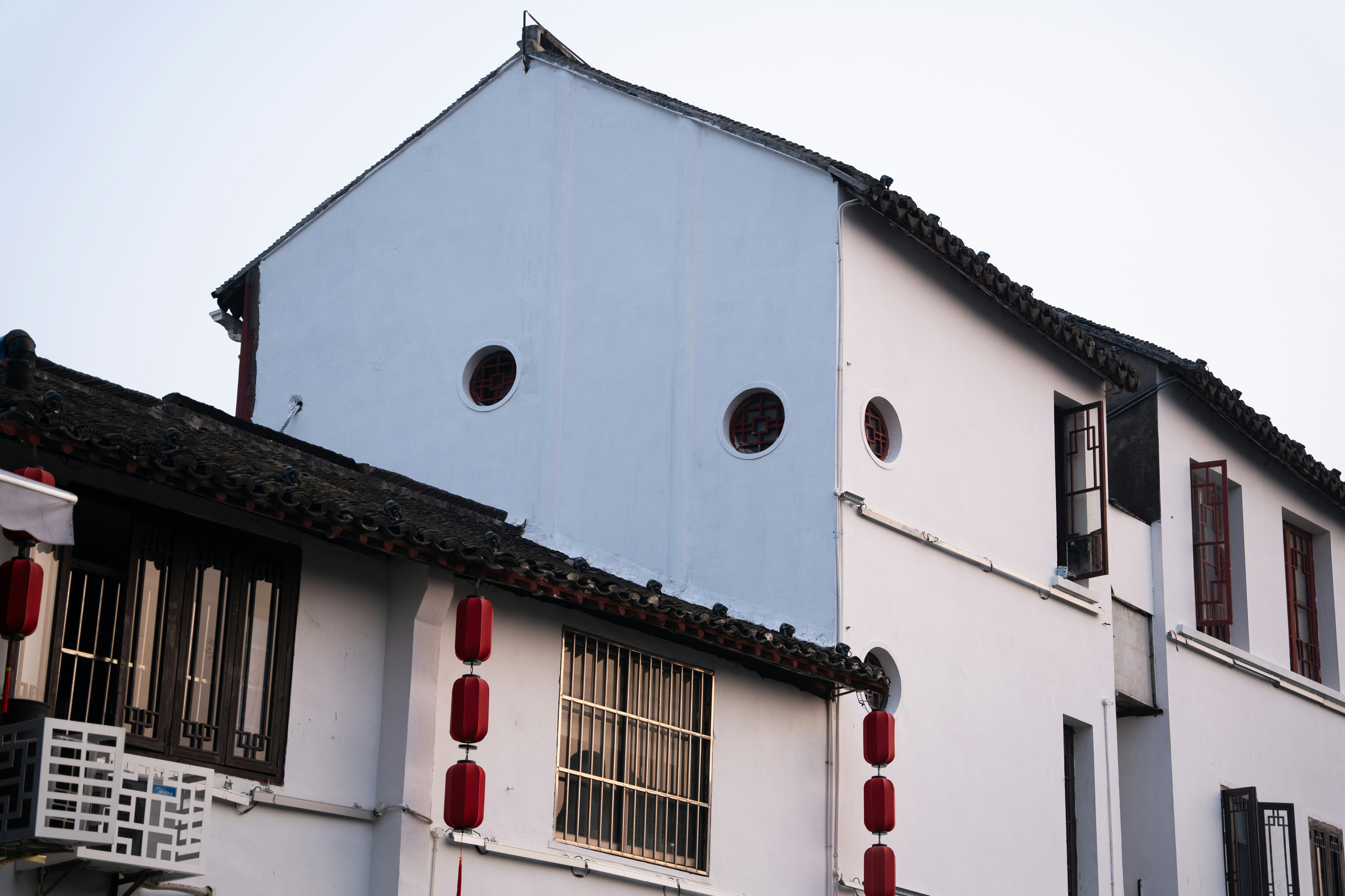 Blue-walled Gable Beneath Red Lanterns