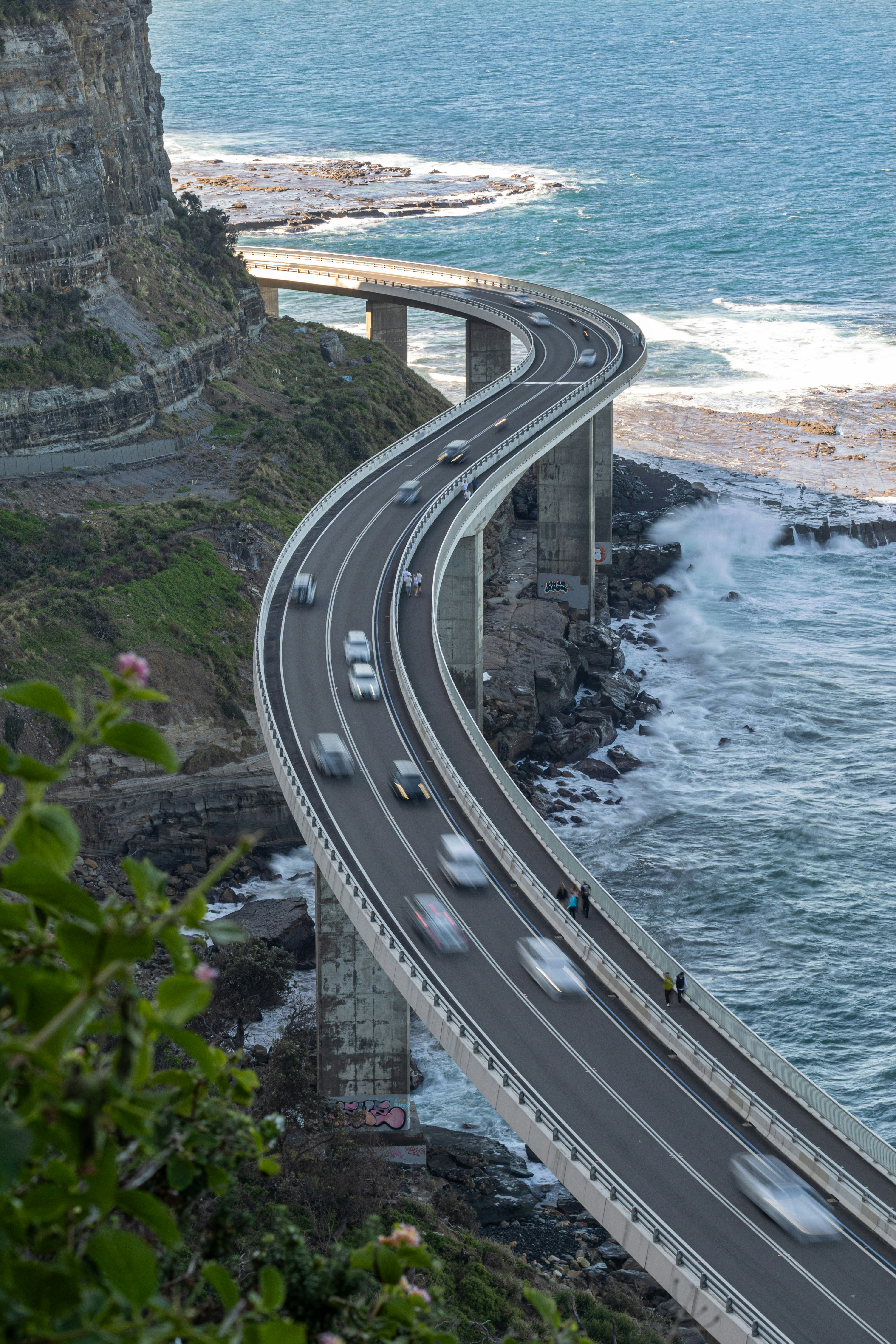 Coastal Curve: A Serpentine Bridge Tilts Over the Atlantic