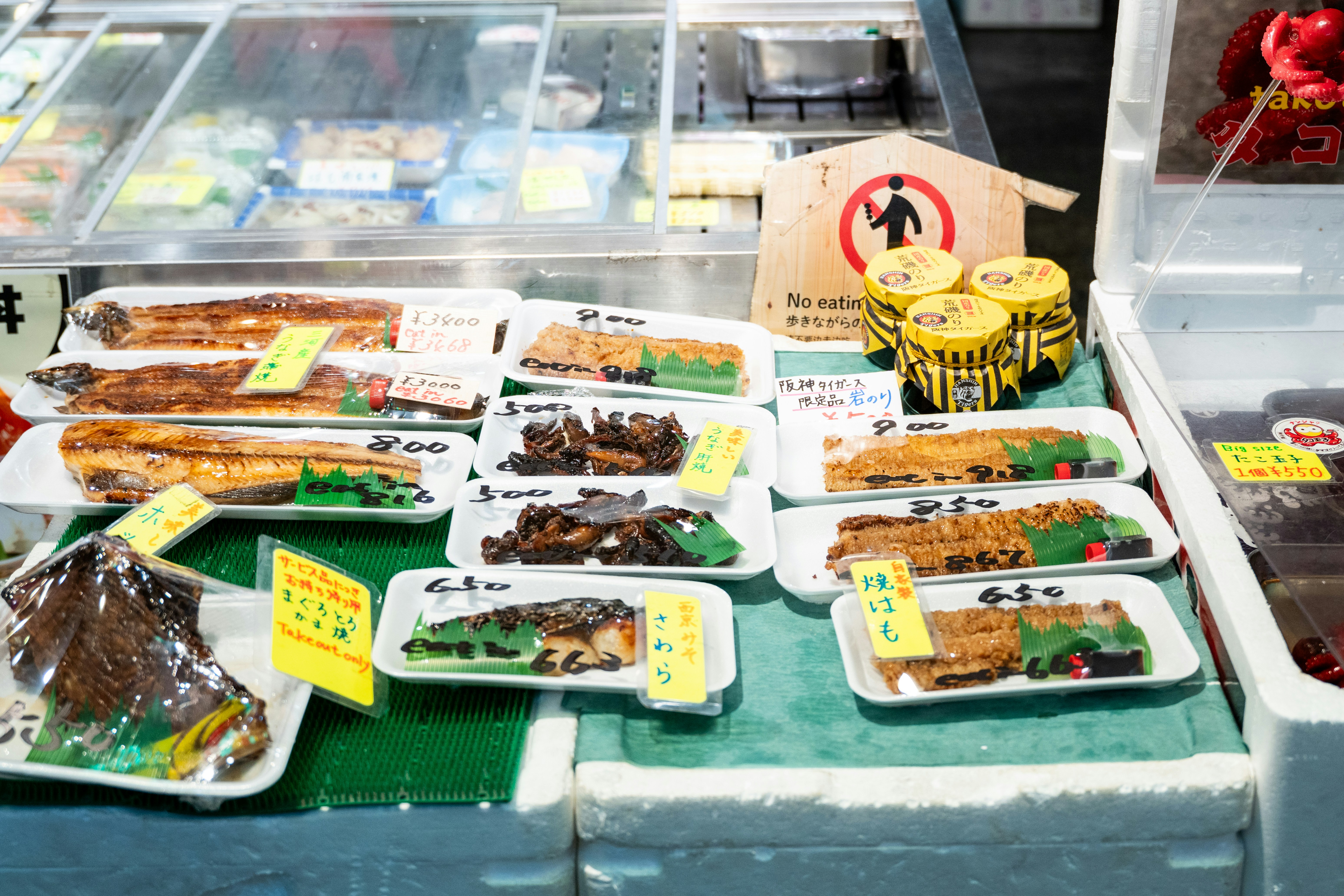 Assorted Japanese Delicacies on a Market Counter