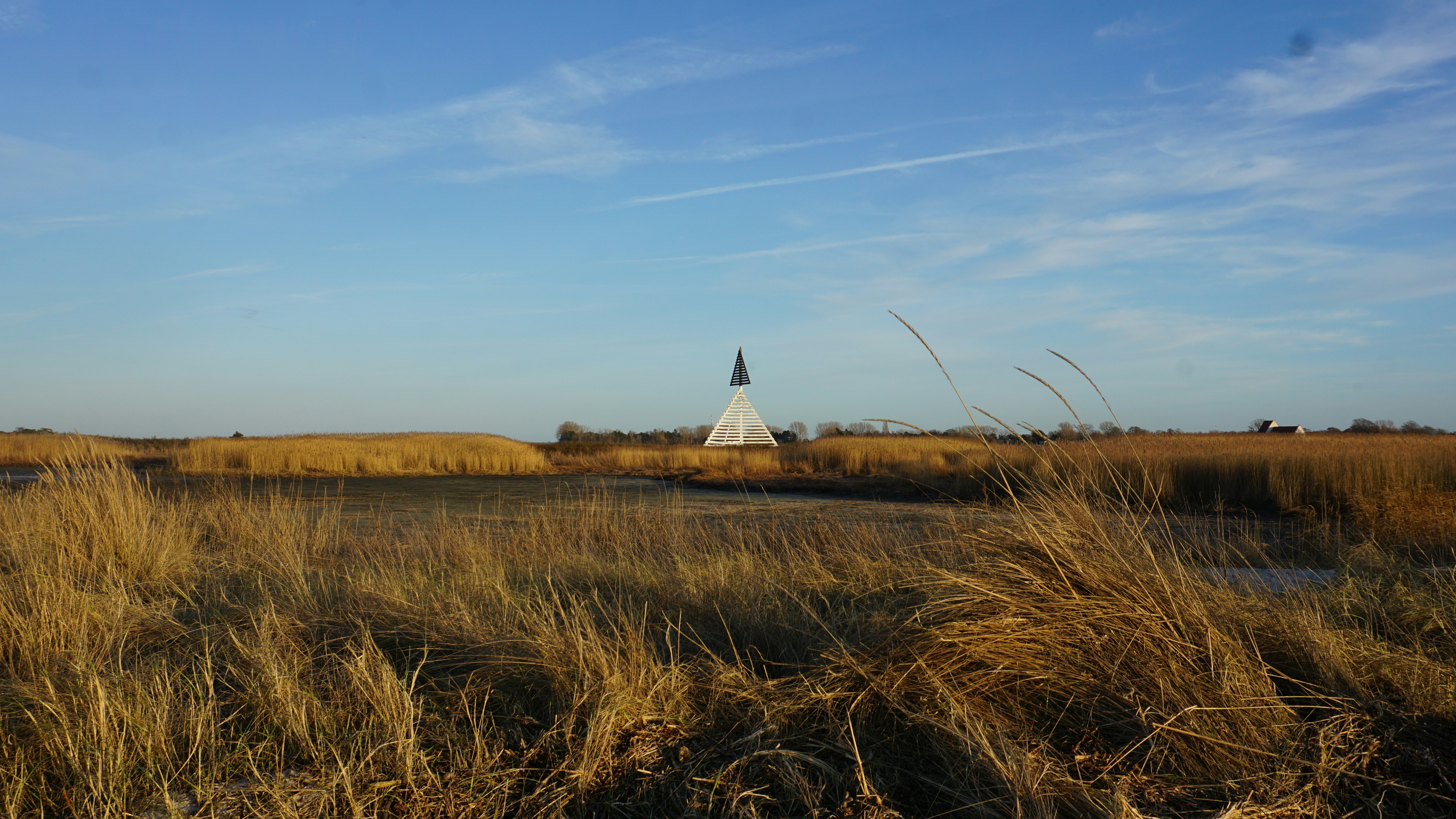 A Quiet Teal of a Tepee Across Prairie Grasses