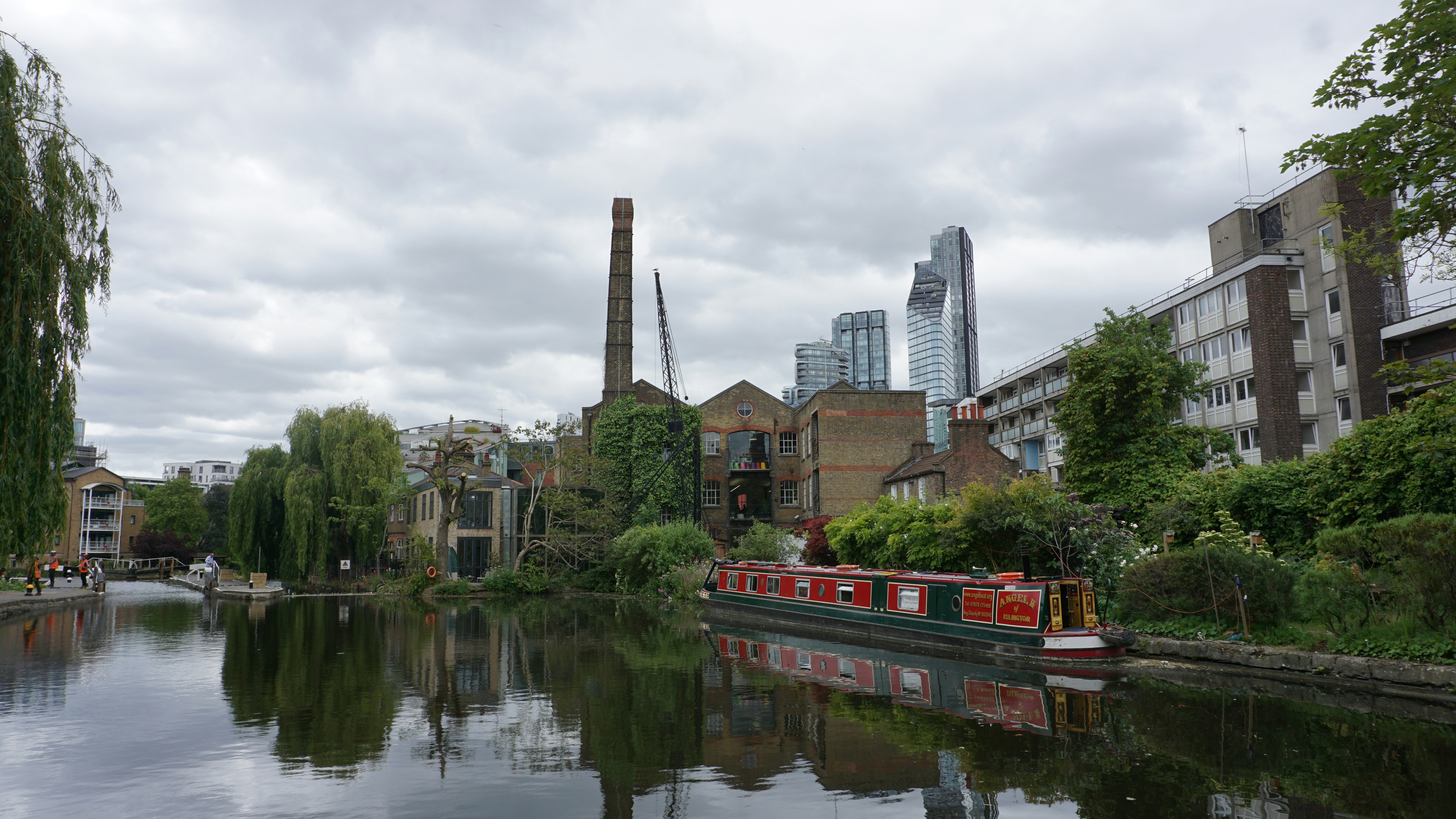 Urban Canal in the Shadow of Modern Towers