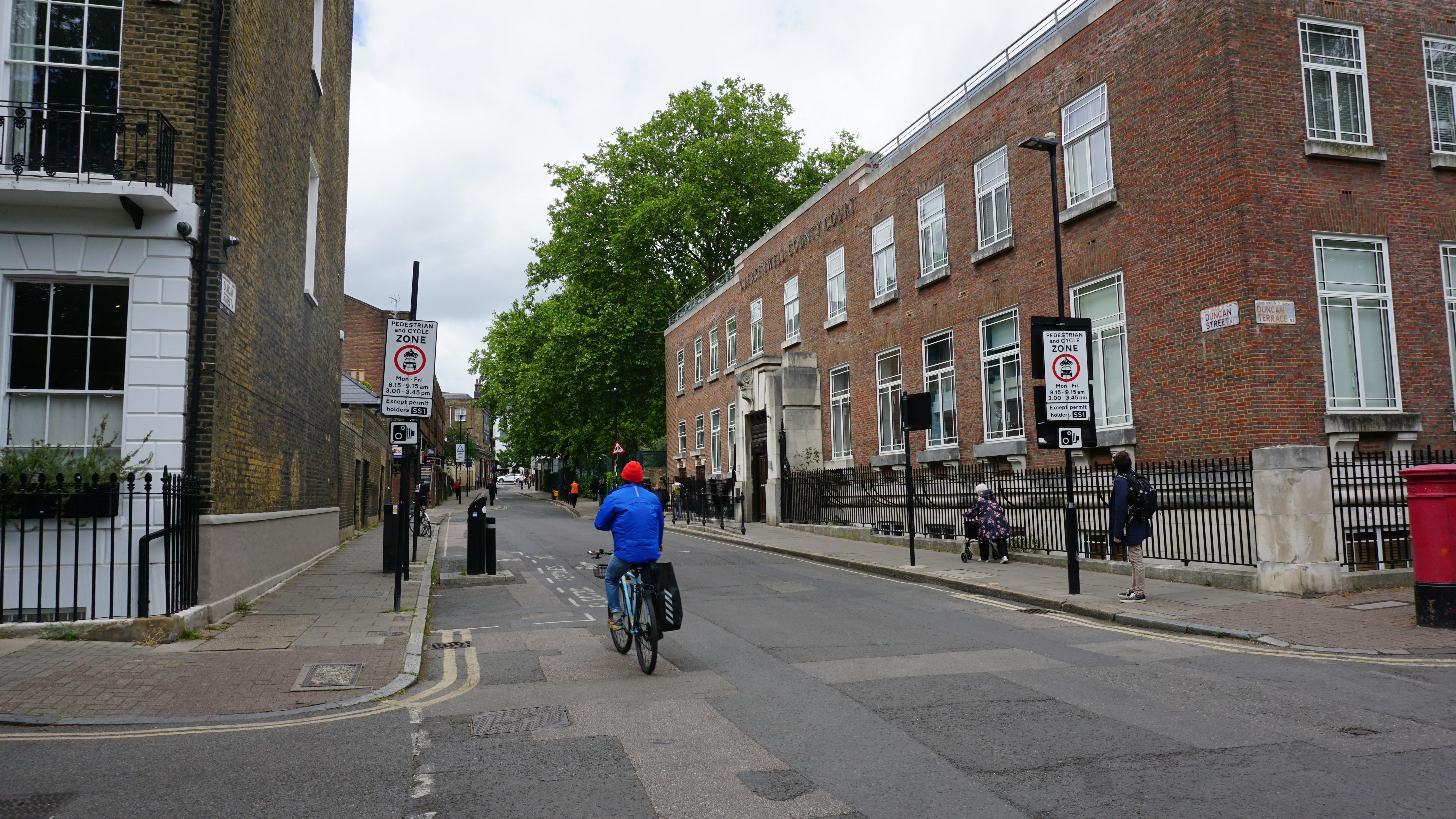 Cyclist in a Quiet Urban Lane