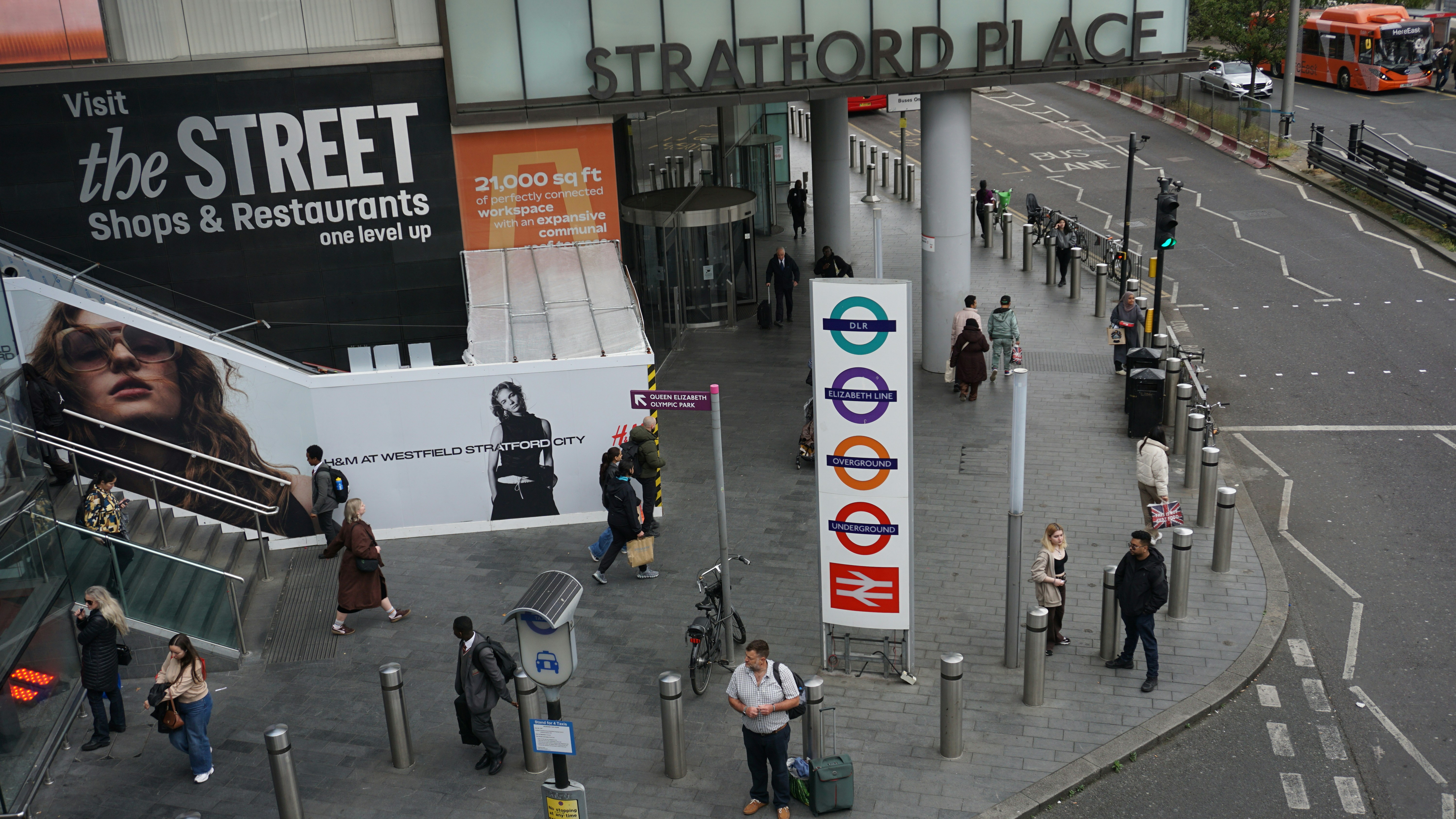 Escalators, Signposts, and Stride: A Busy Entrance to Stratford Place