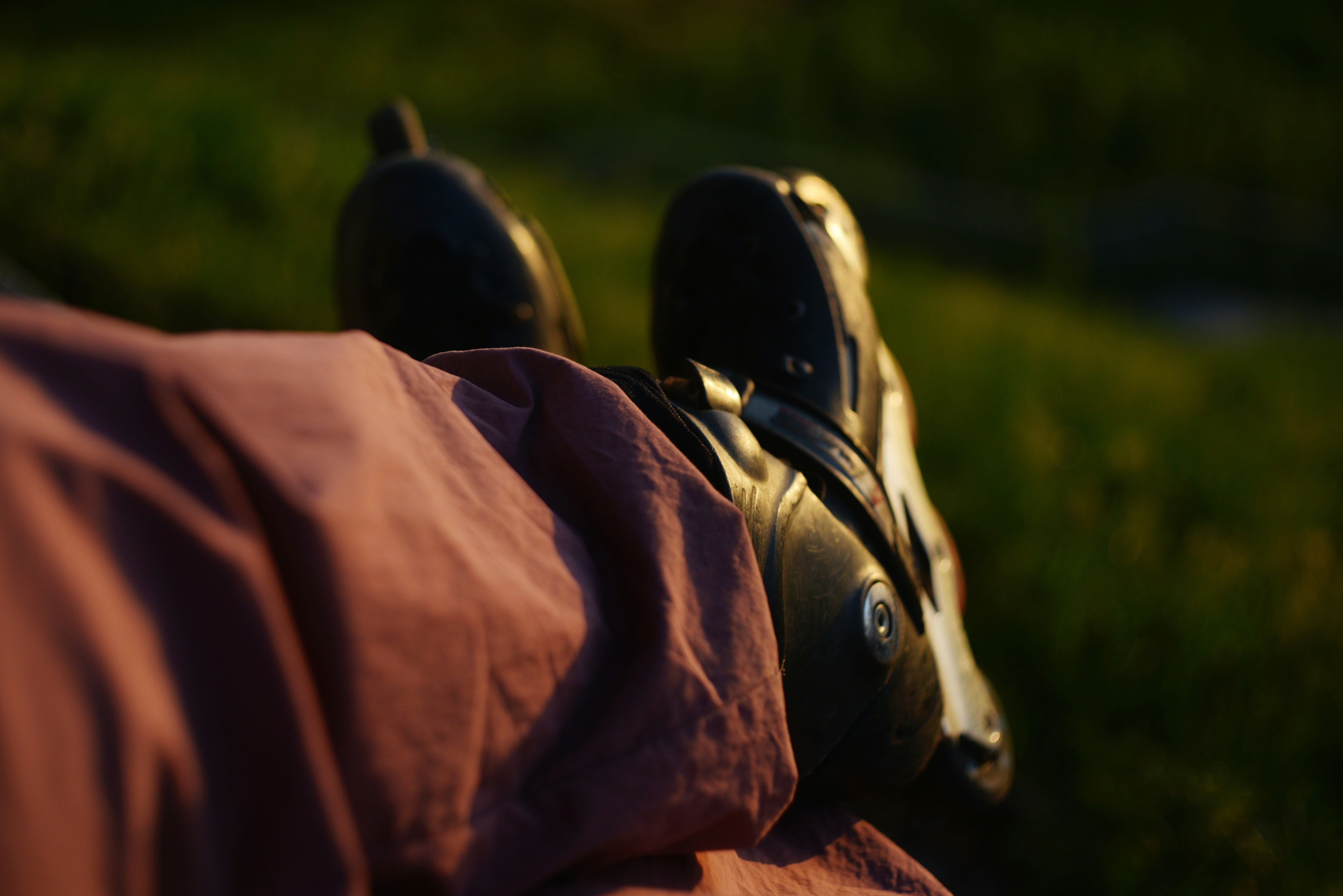 Quiet Evening Leg: Boots and Fabric in Golden Light